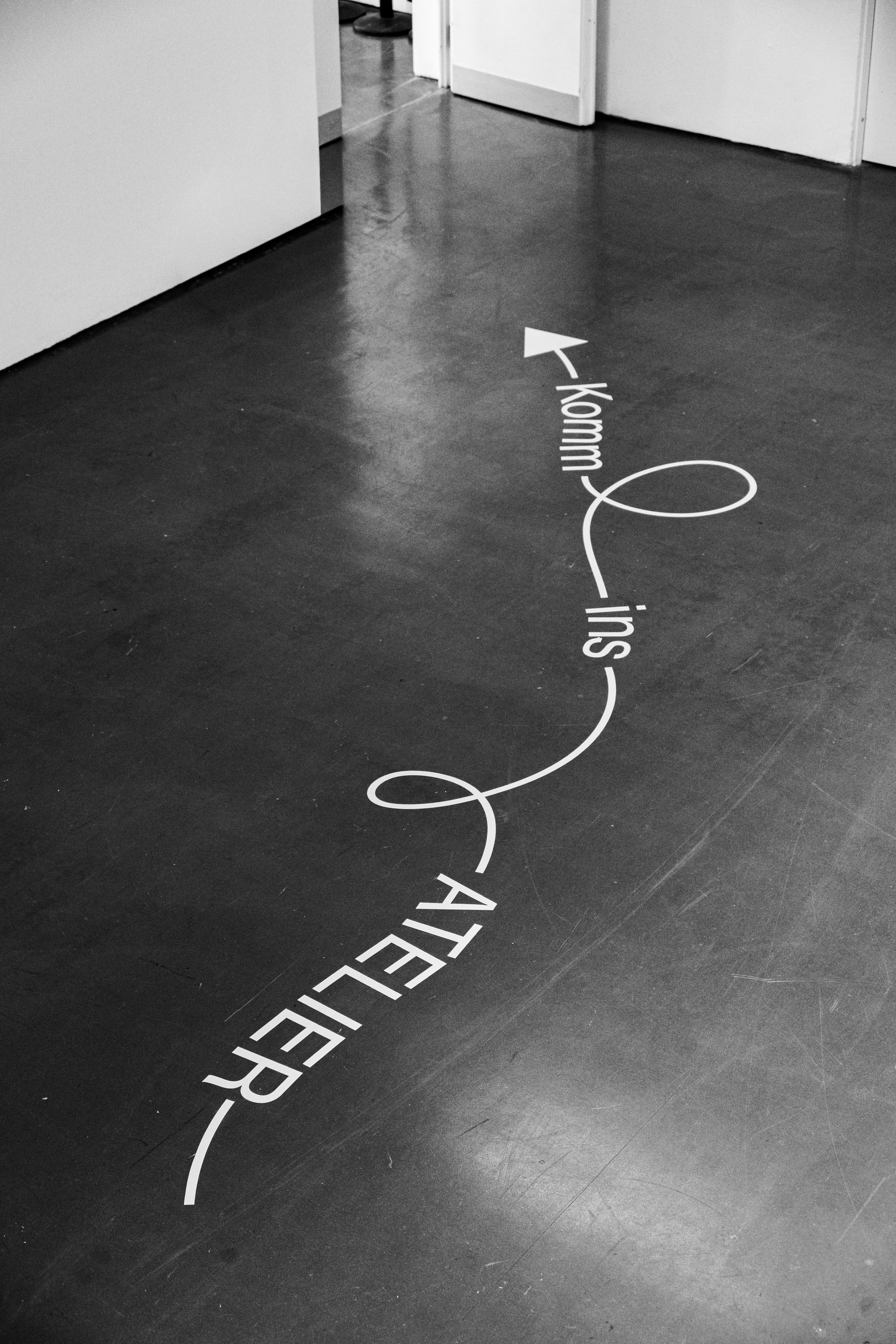 Luminous Script on a Gallery Floor