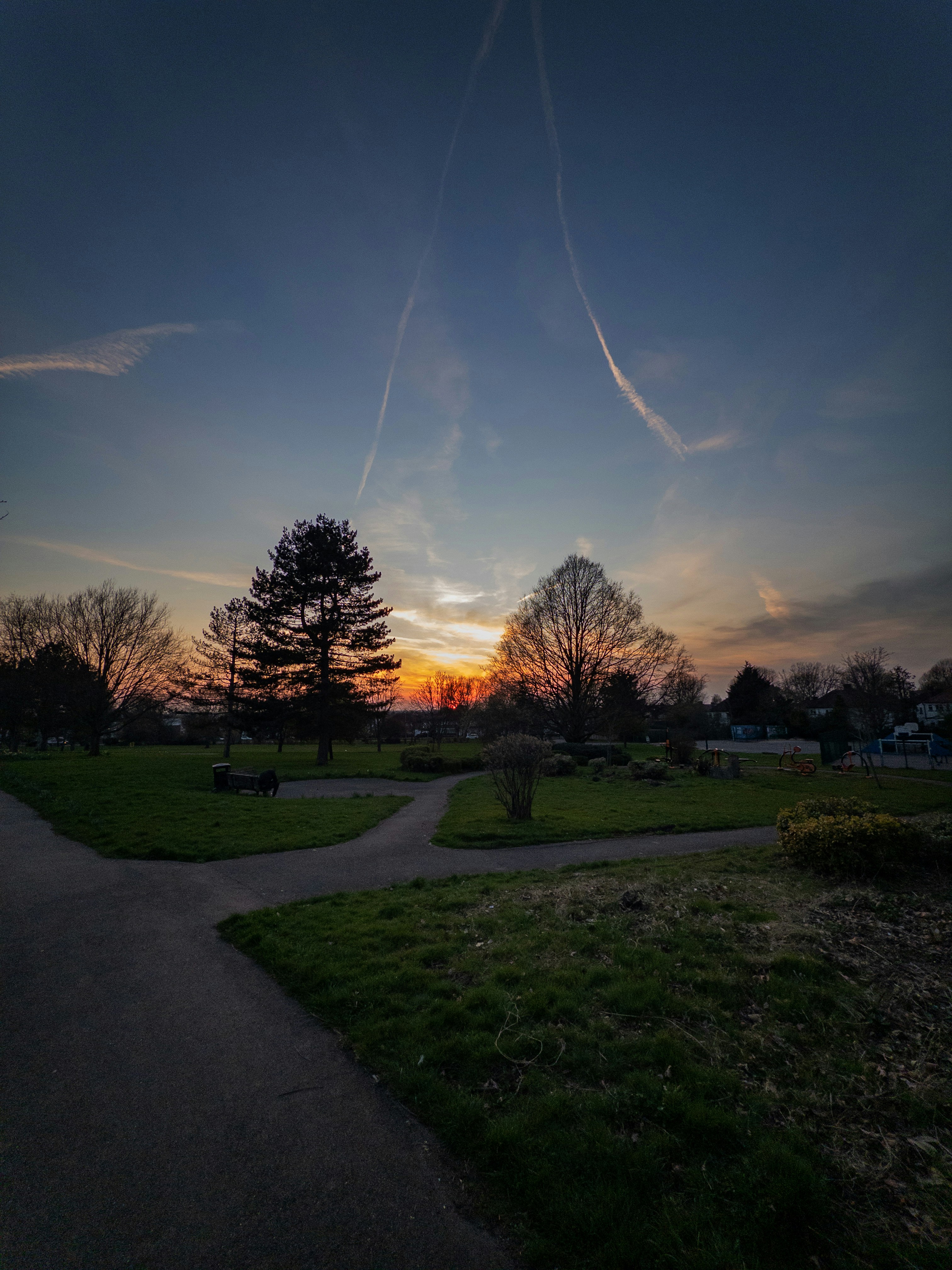Sunset Surge Over a Quiet Park Path
