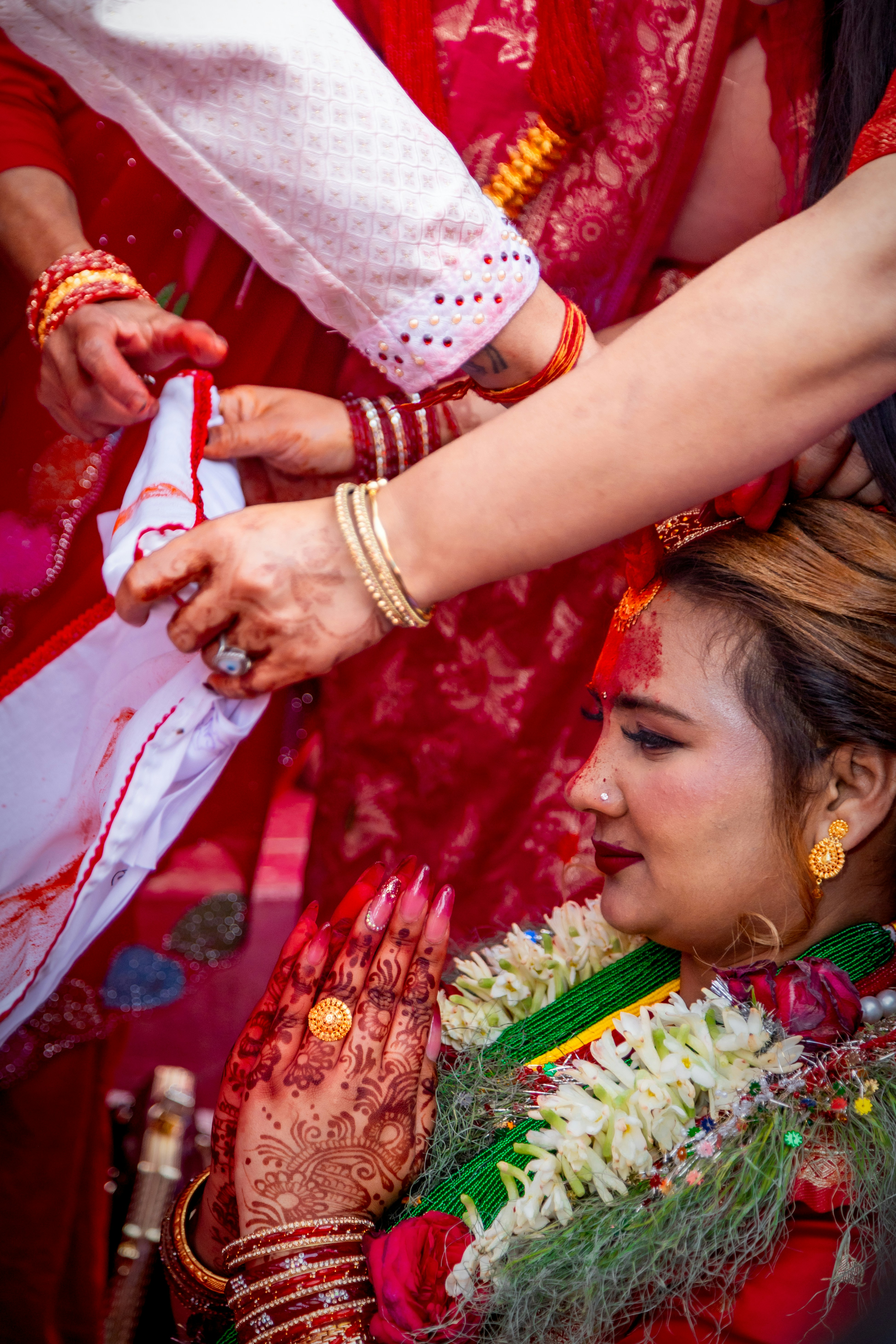 Garlanded Moment: A Bride’s Devotional Calm Amid Henna Traditions