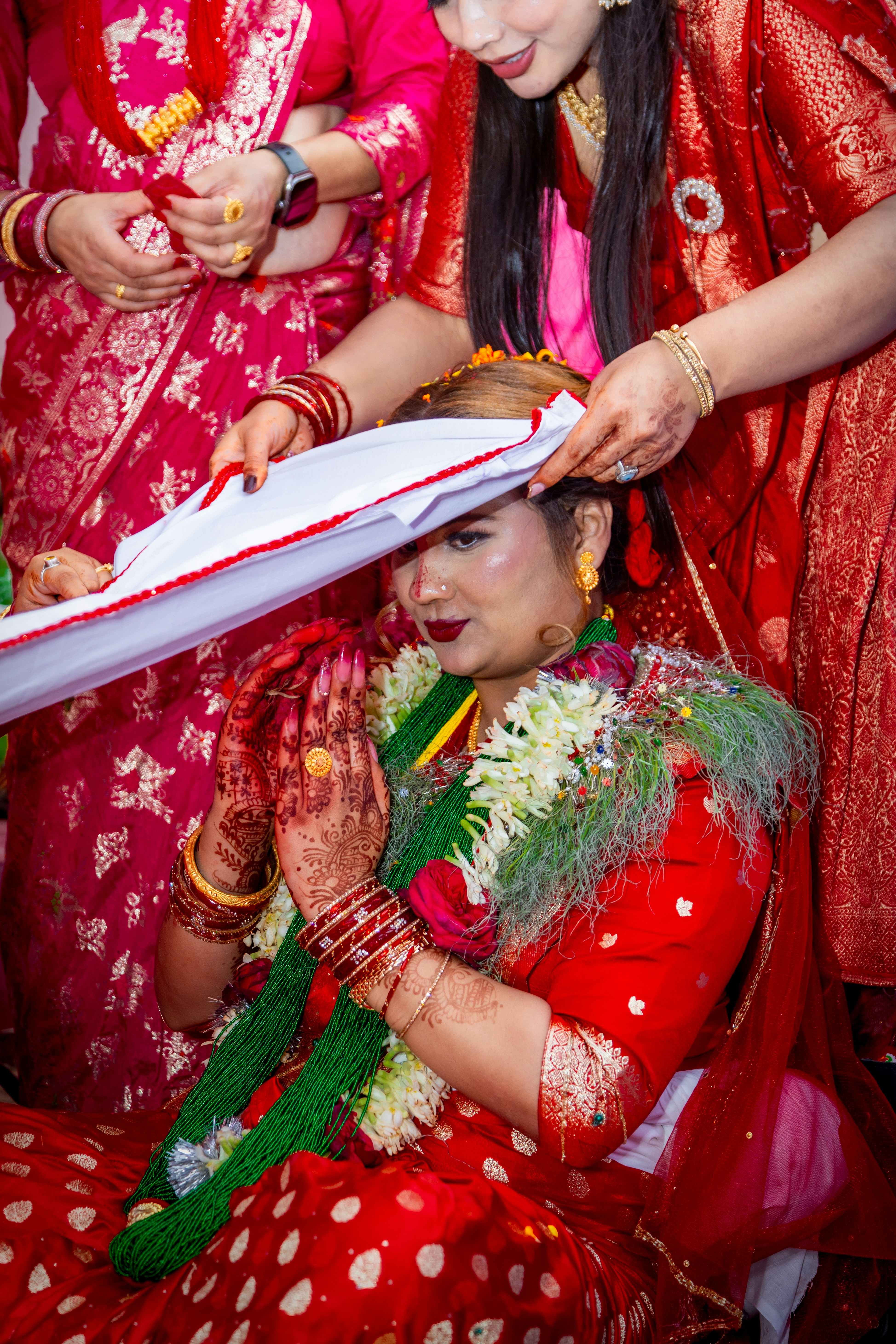 Red Veil of Blessing: A Bride Under the Veil of Ceremonial Hands