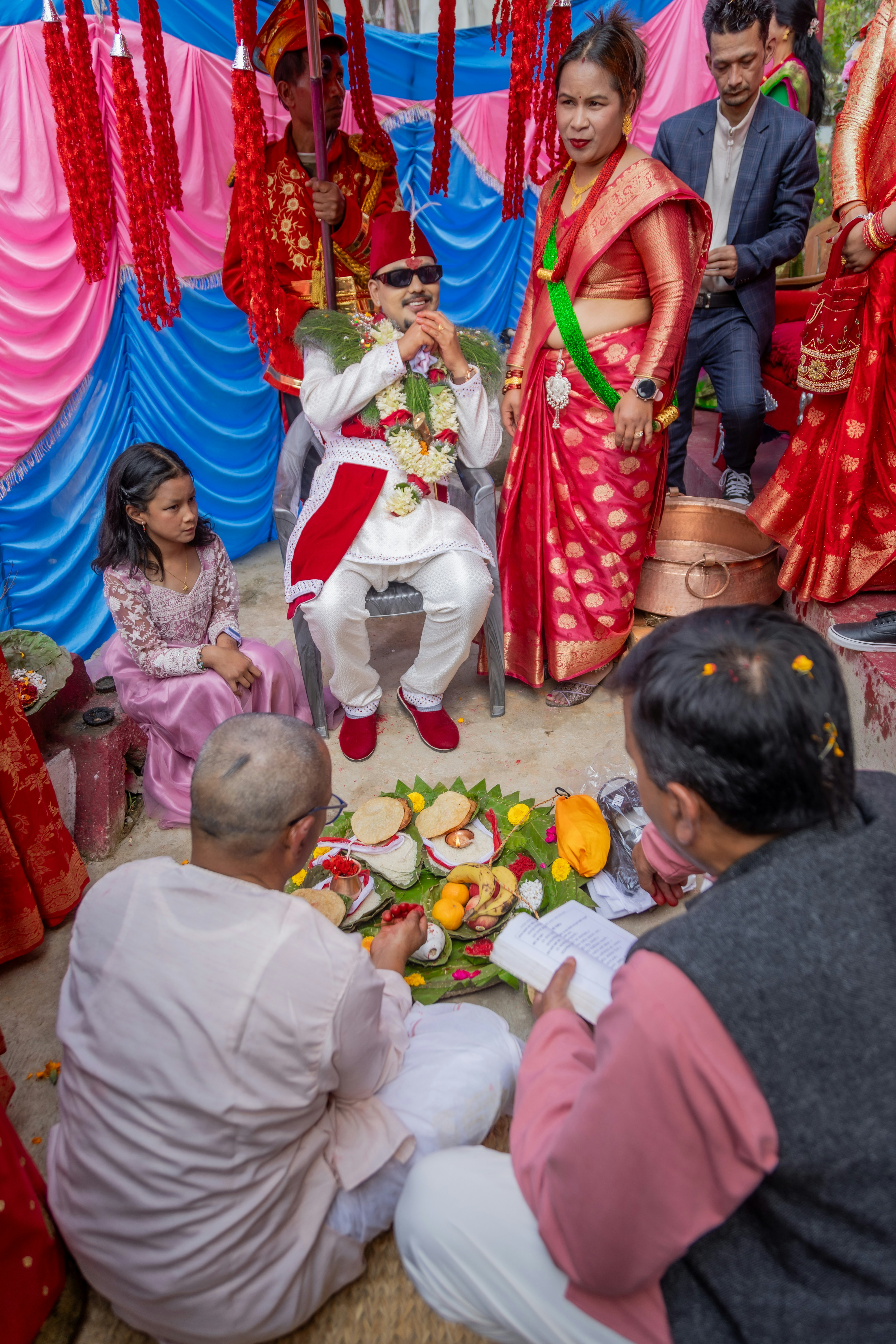 Ceremonial Toast Under a Colorful Canopy
