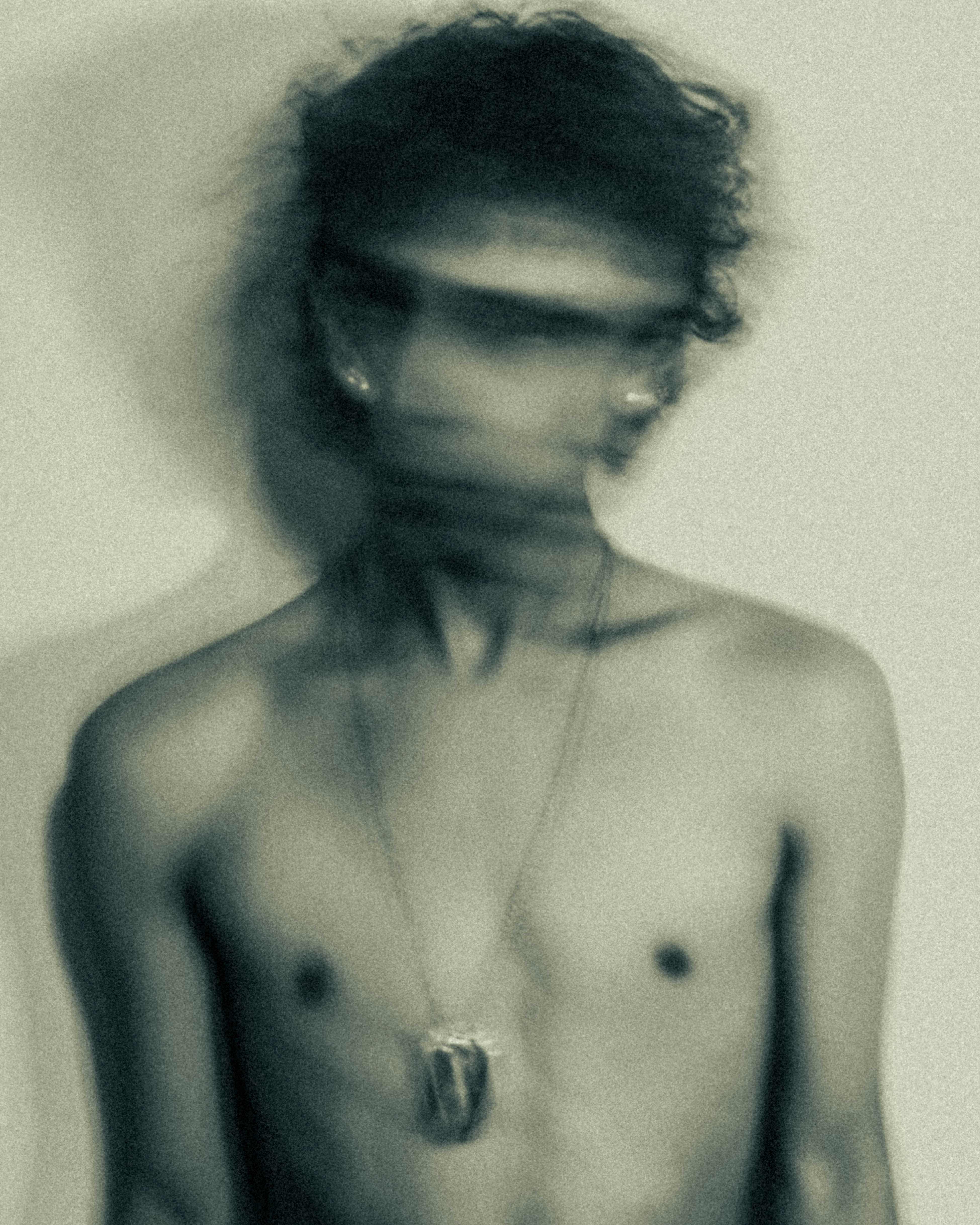 Blurring Silence: A Shadowed Portrait in Motion