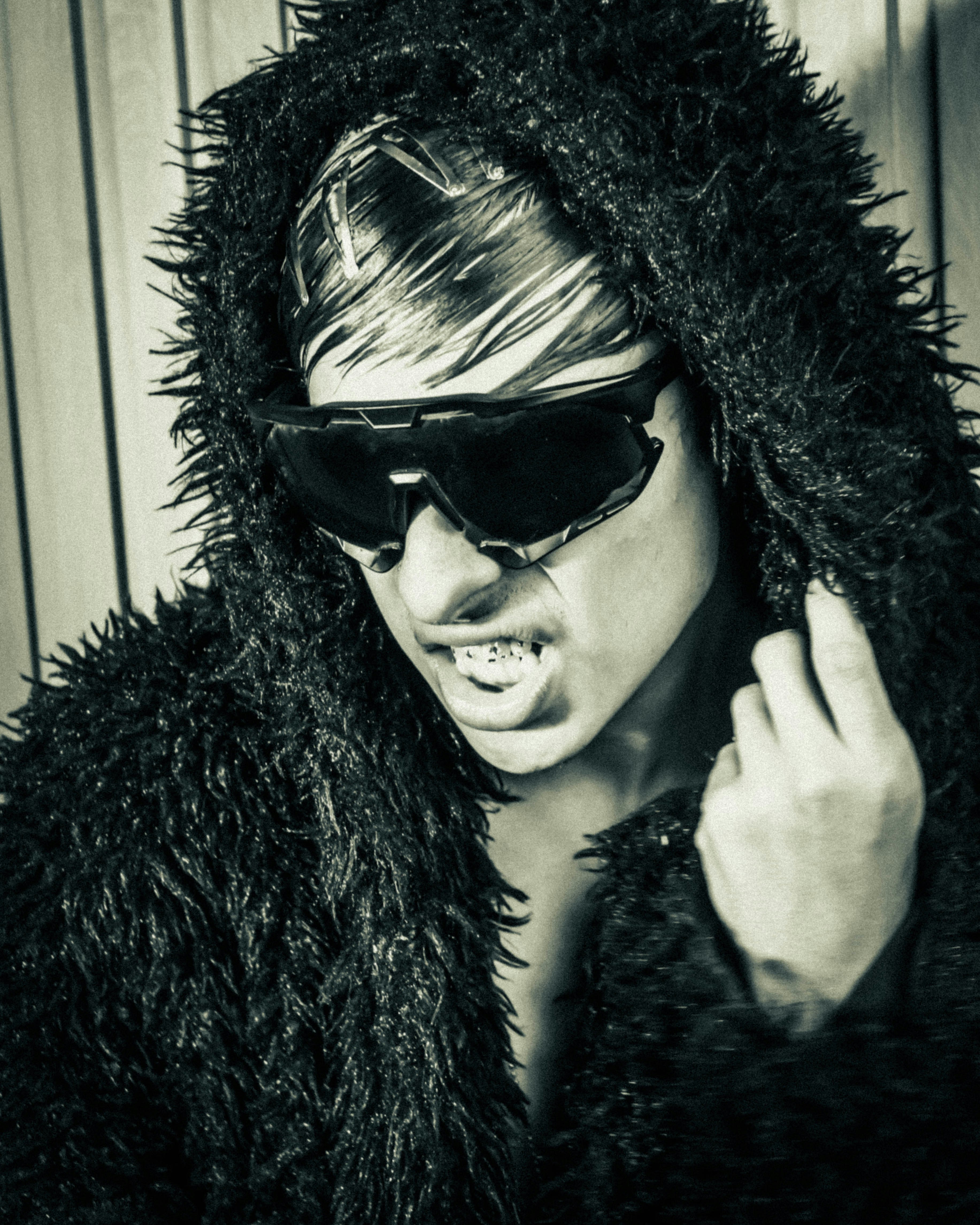 Bold Edge: A Sunglasses-Clad Silhouette in Fur and Fury