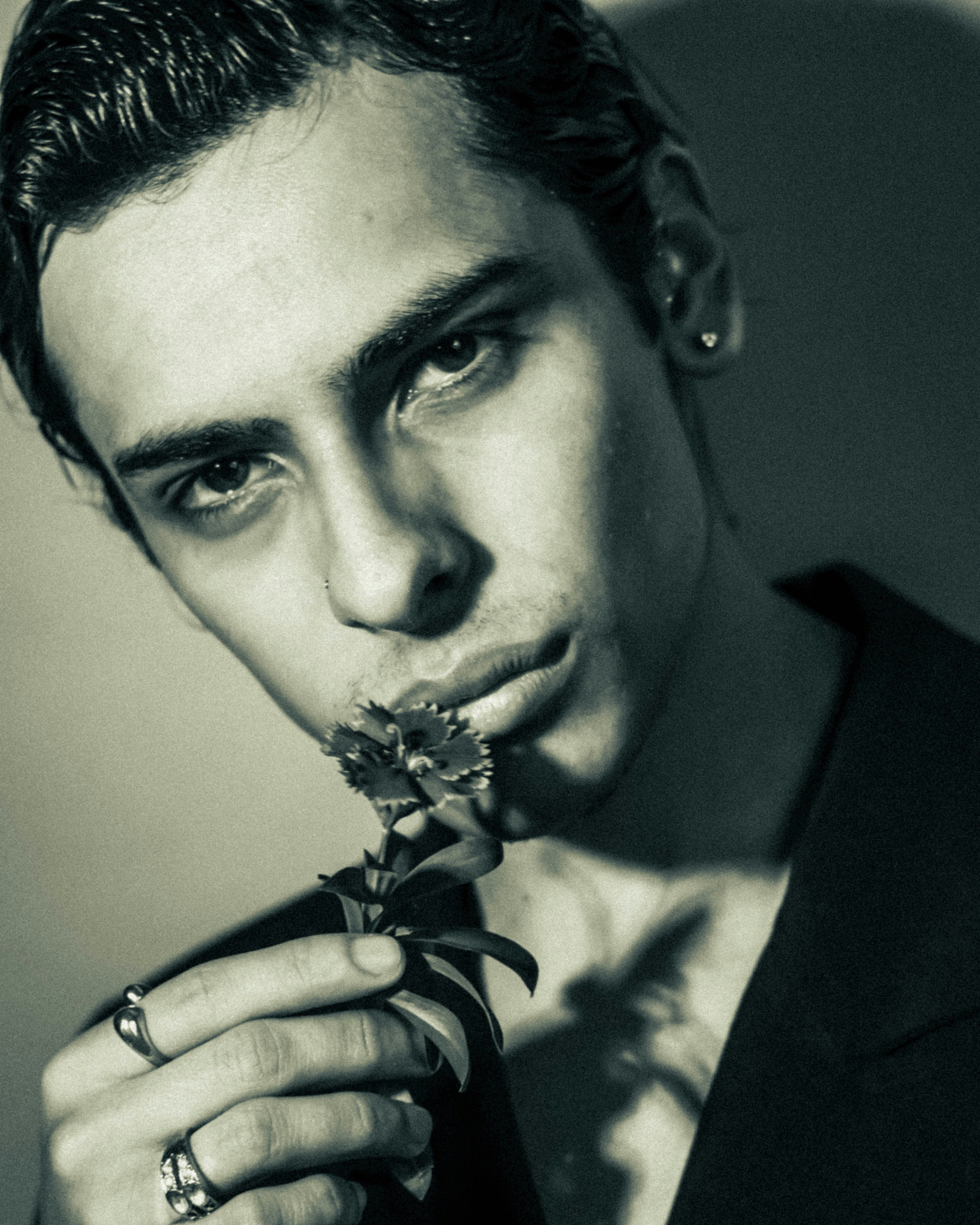 Whispers of a Bloom: A Quiet Portrait with a Flower's Edge