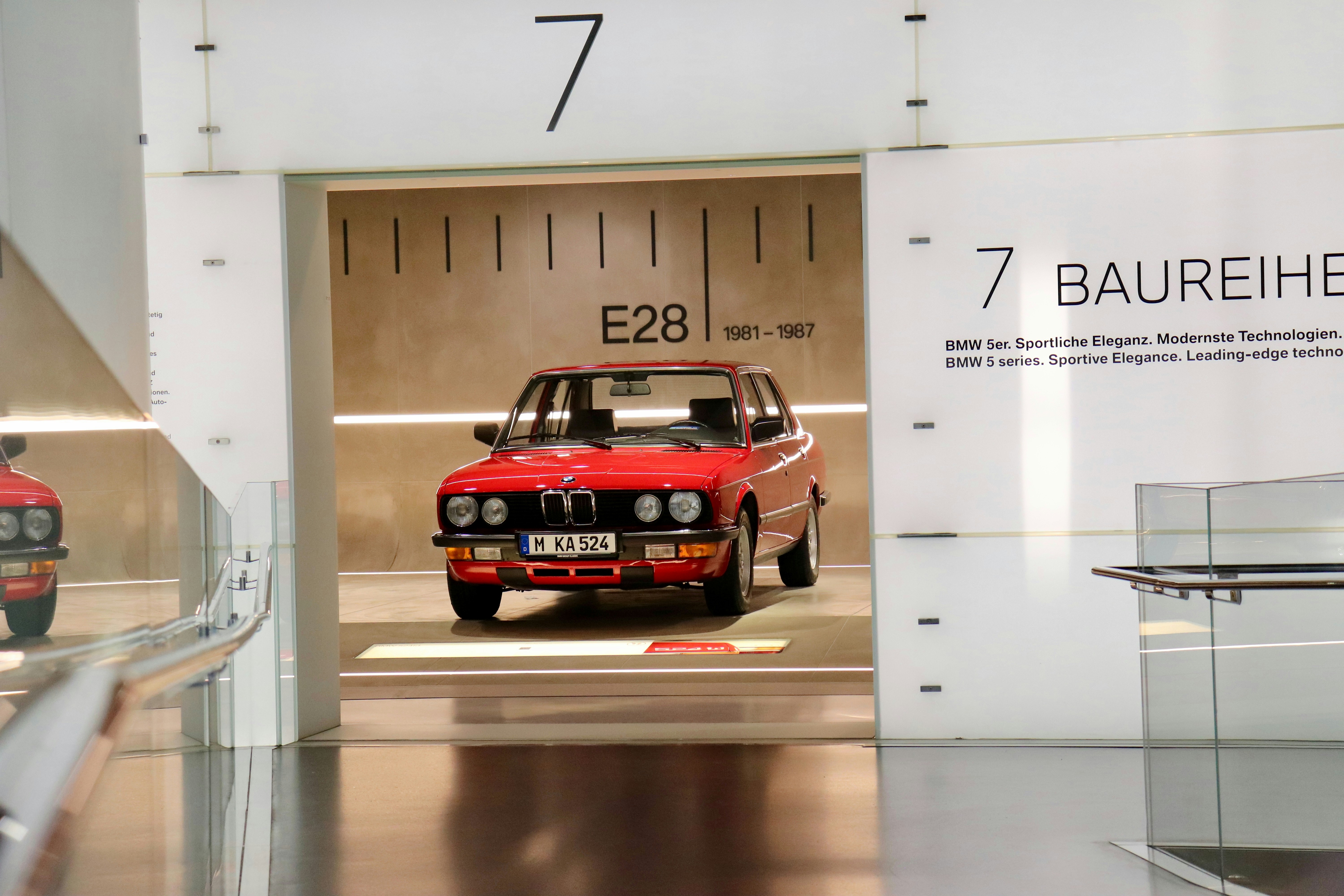 Red Classic BMW Surfaces in a White-Walled Gallery