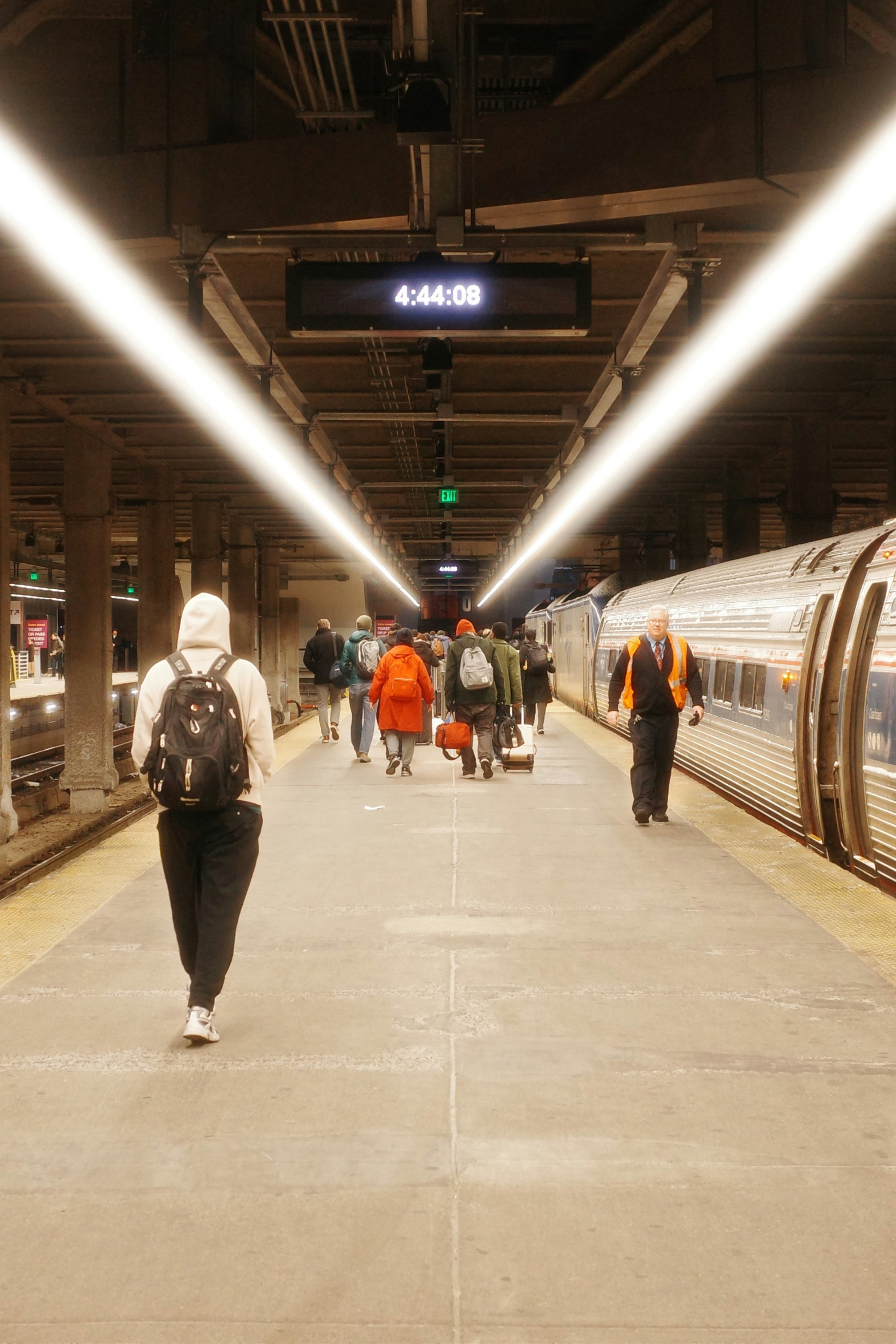 Arrival at the Midnight Platform: Commuters Step into the Quiet Between Trains
