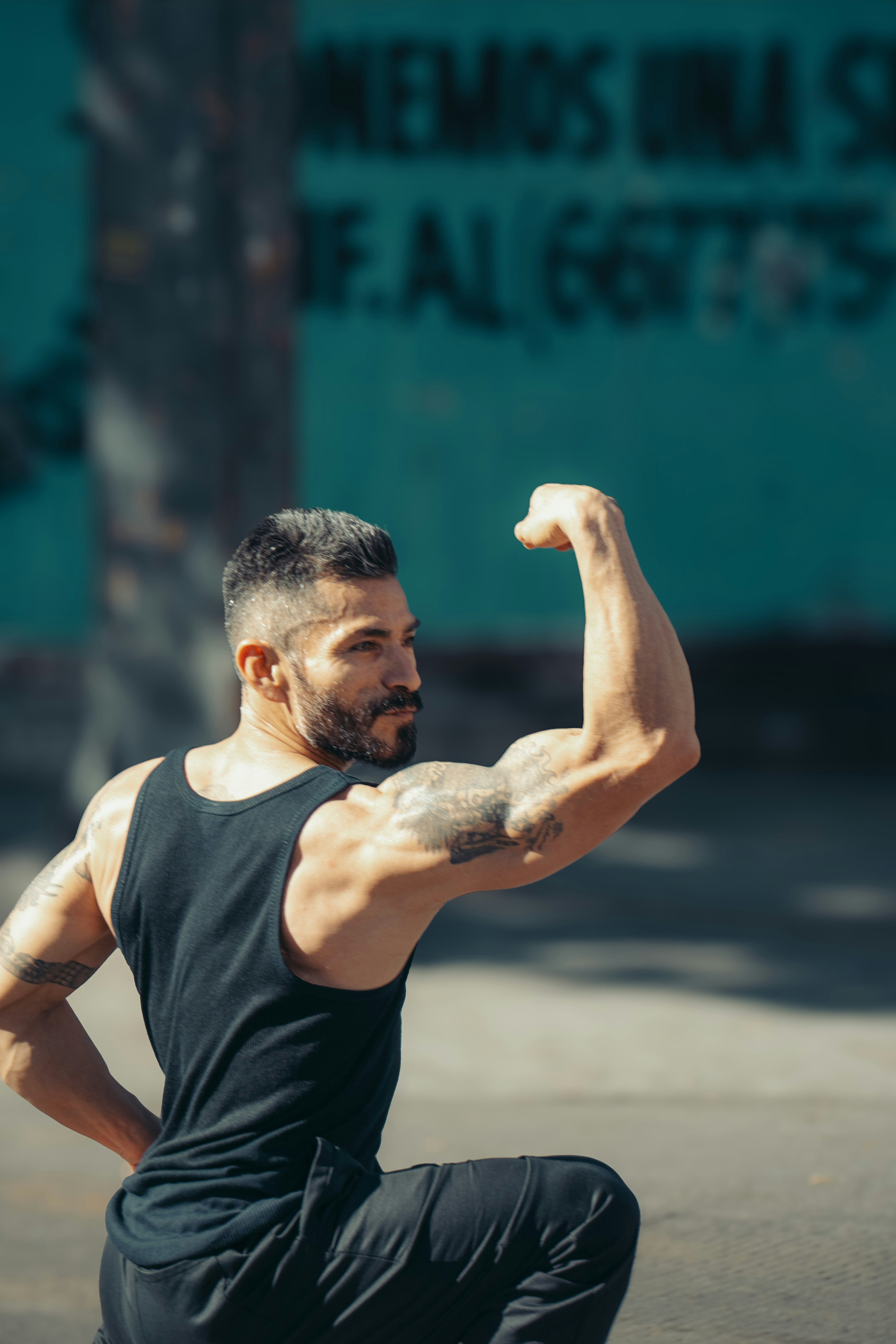 Strength Unfolded: A Striking Pose in Mid-Workout Light