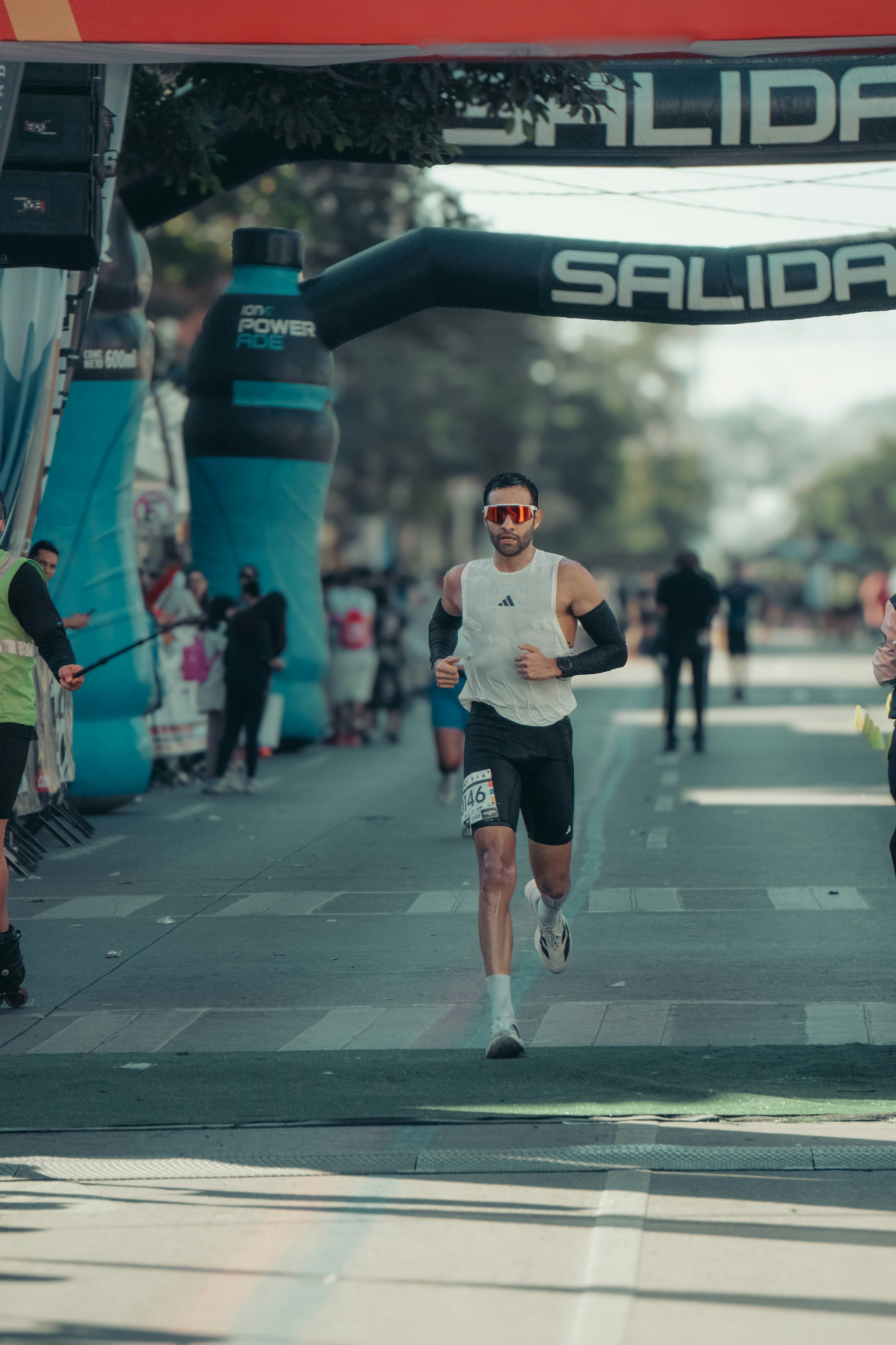 Race to the Finish: Runner Breaks Through the Arch at Daylight Marathon