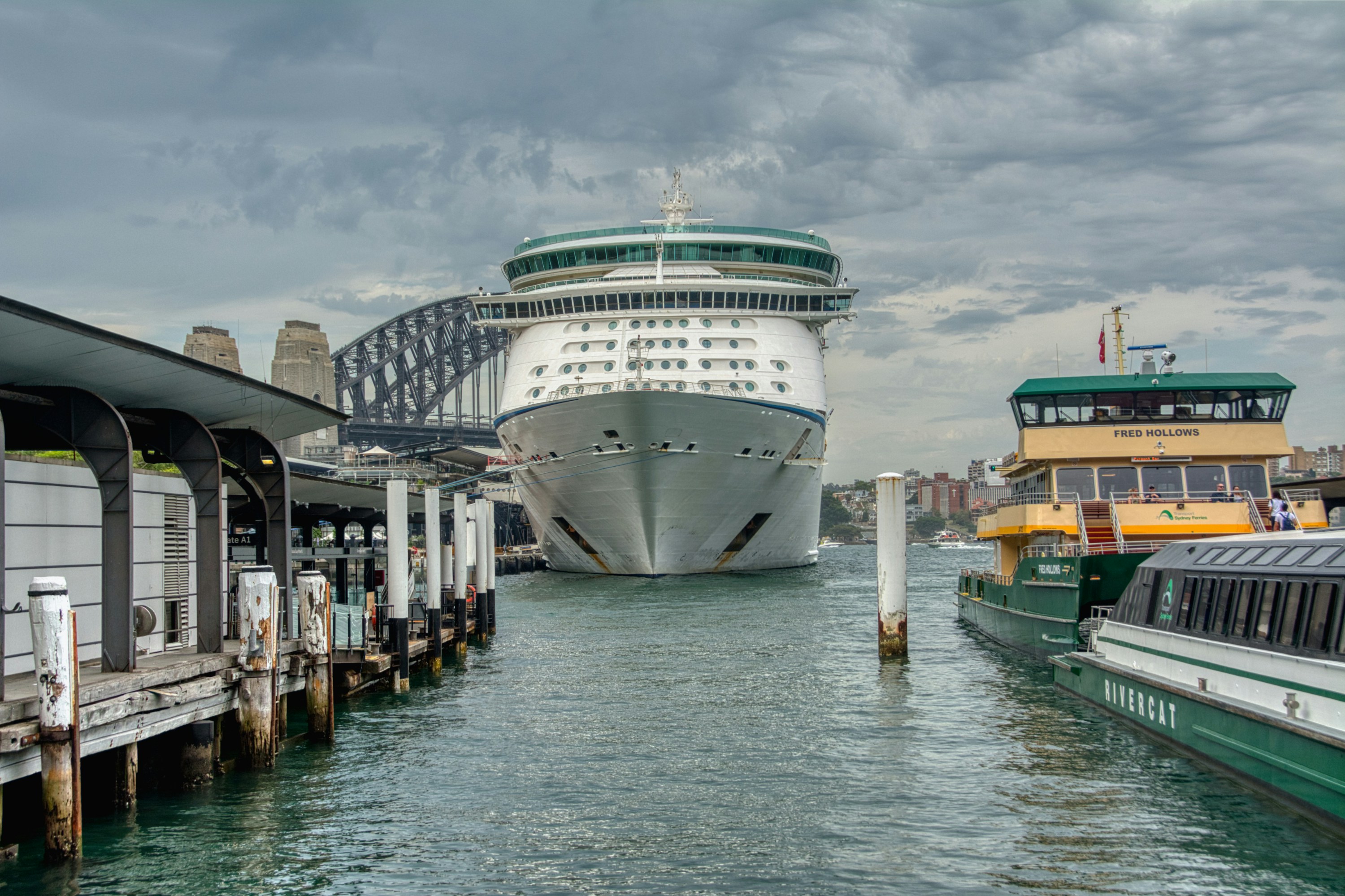 Dockside Welcome: The Mighty Cruise Looming Over a Quiet Pier