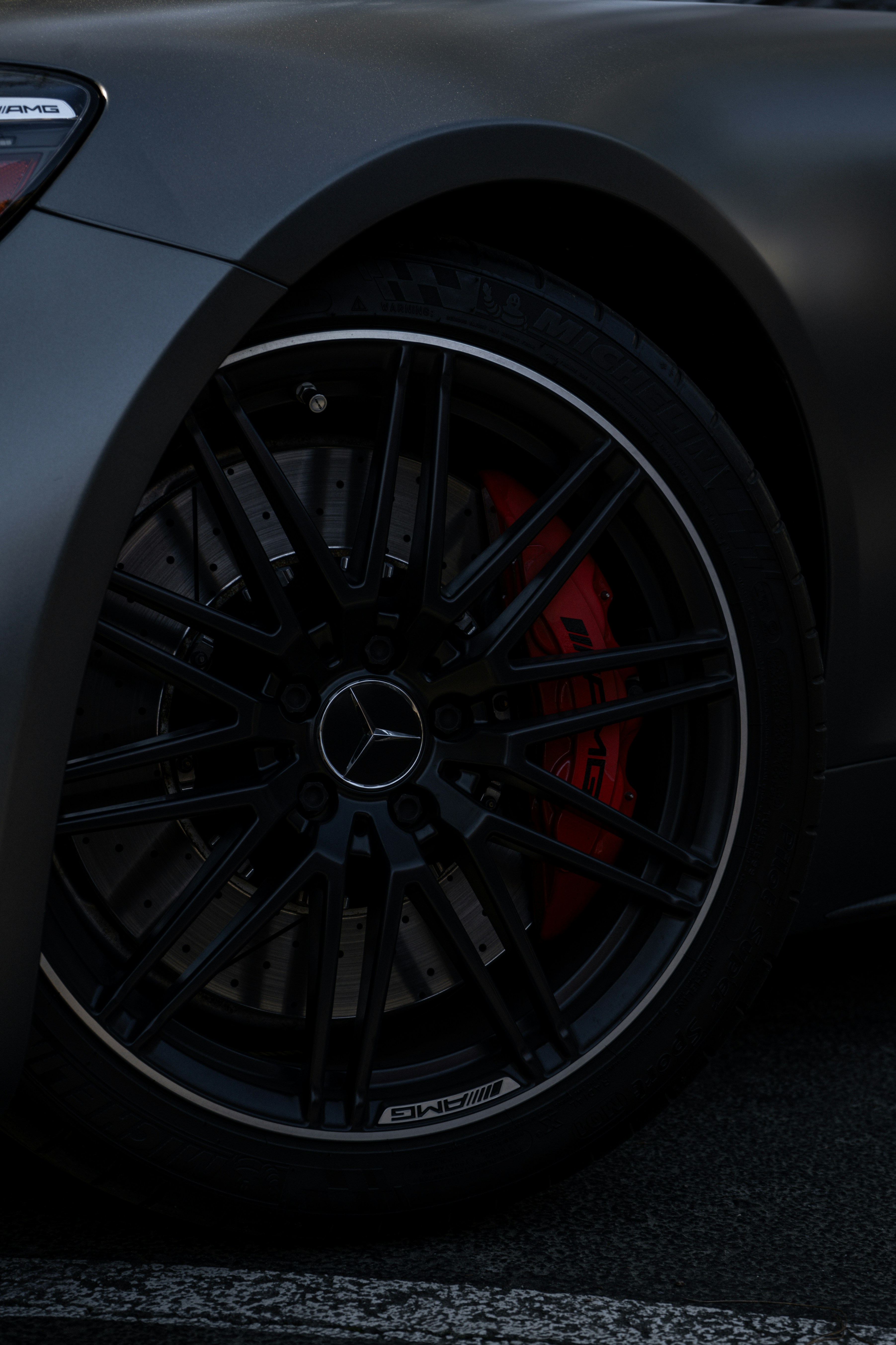 Shadowed Wheel, Crimson Brake Caliper: A Molten Black Mercedes Power