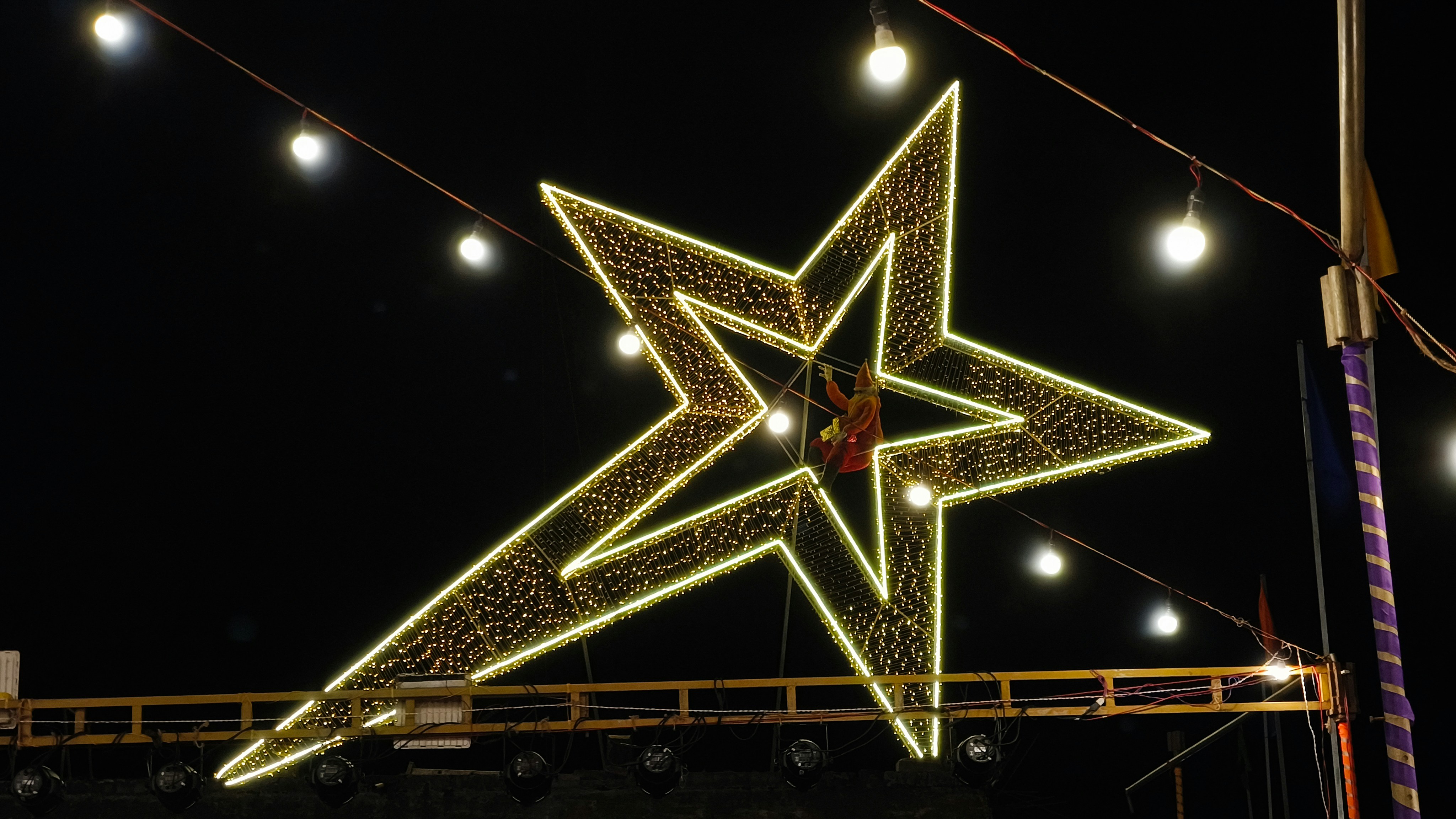 Glowing Star Overhead: Night Festive Décor on a Strings-lit Stage