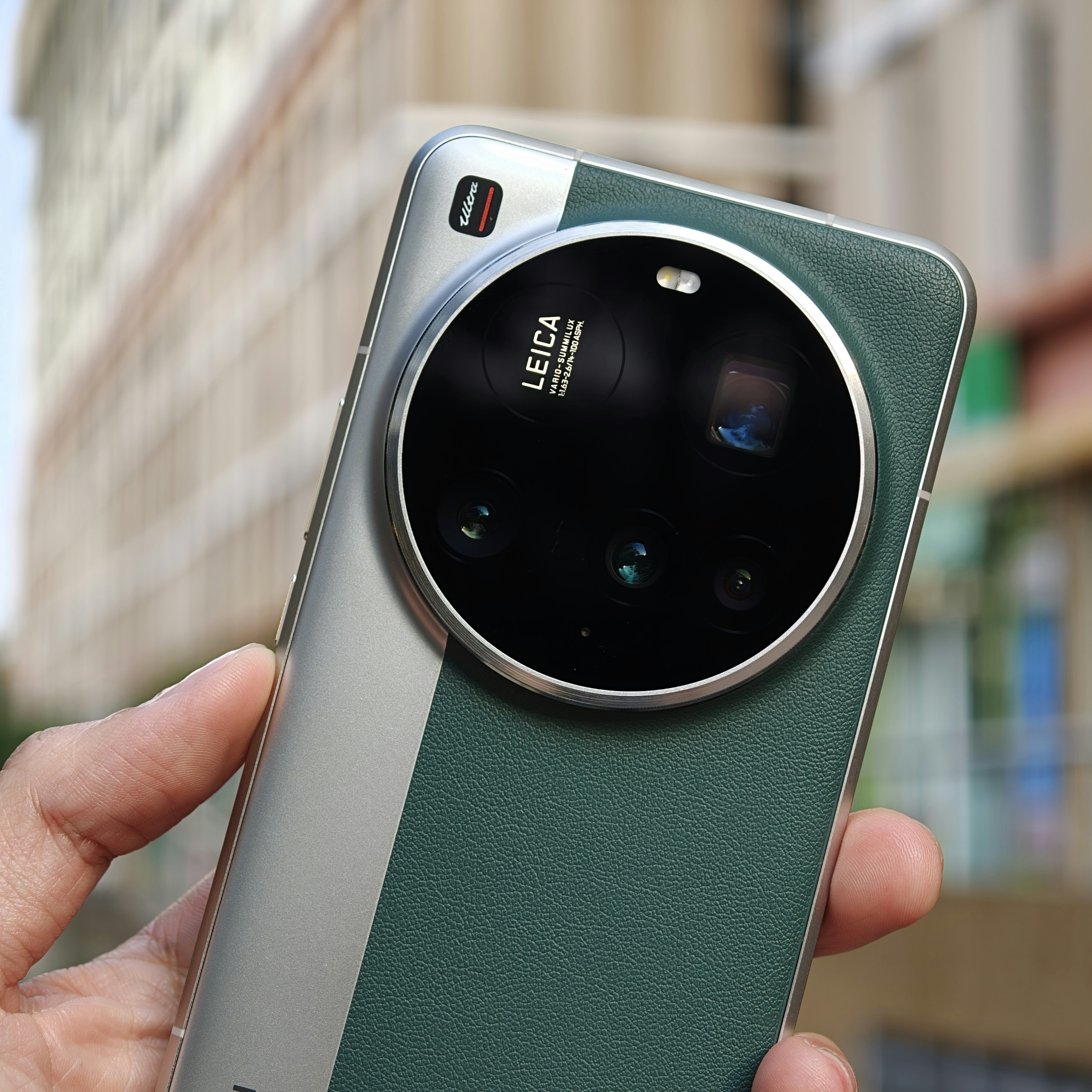 Green leather finish meets circular camera halo on a retro-styled Leica-backed smartphone