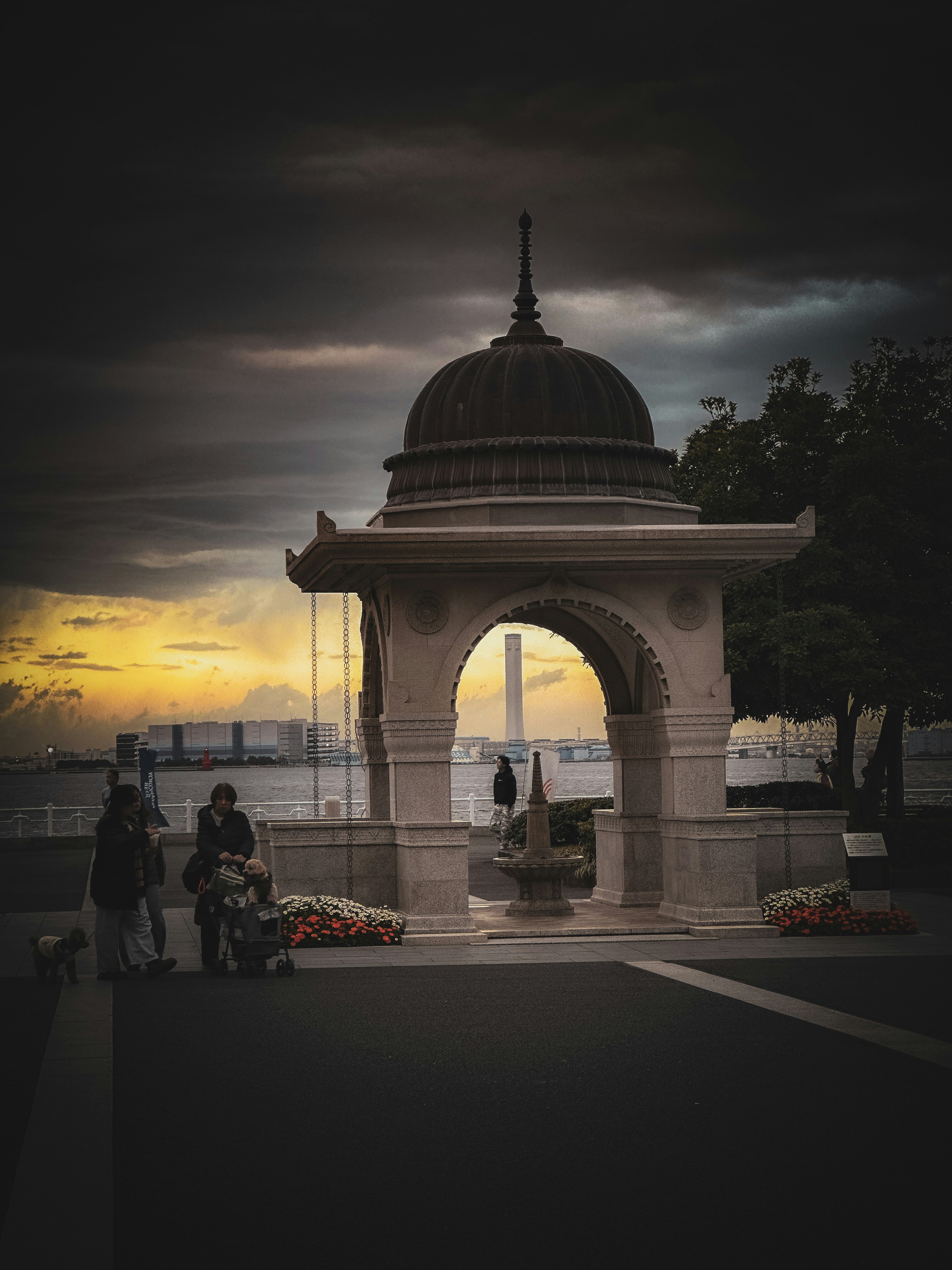 Dawn Arch by the Water: A Monument Stands Against the Sky