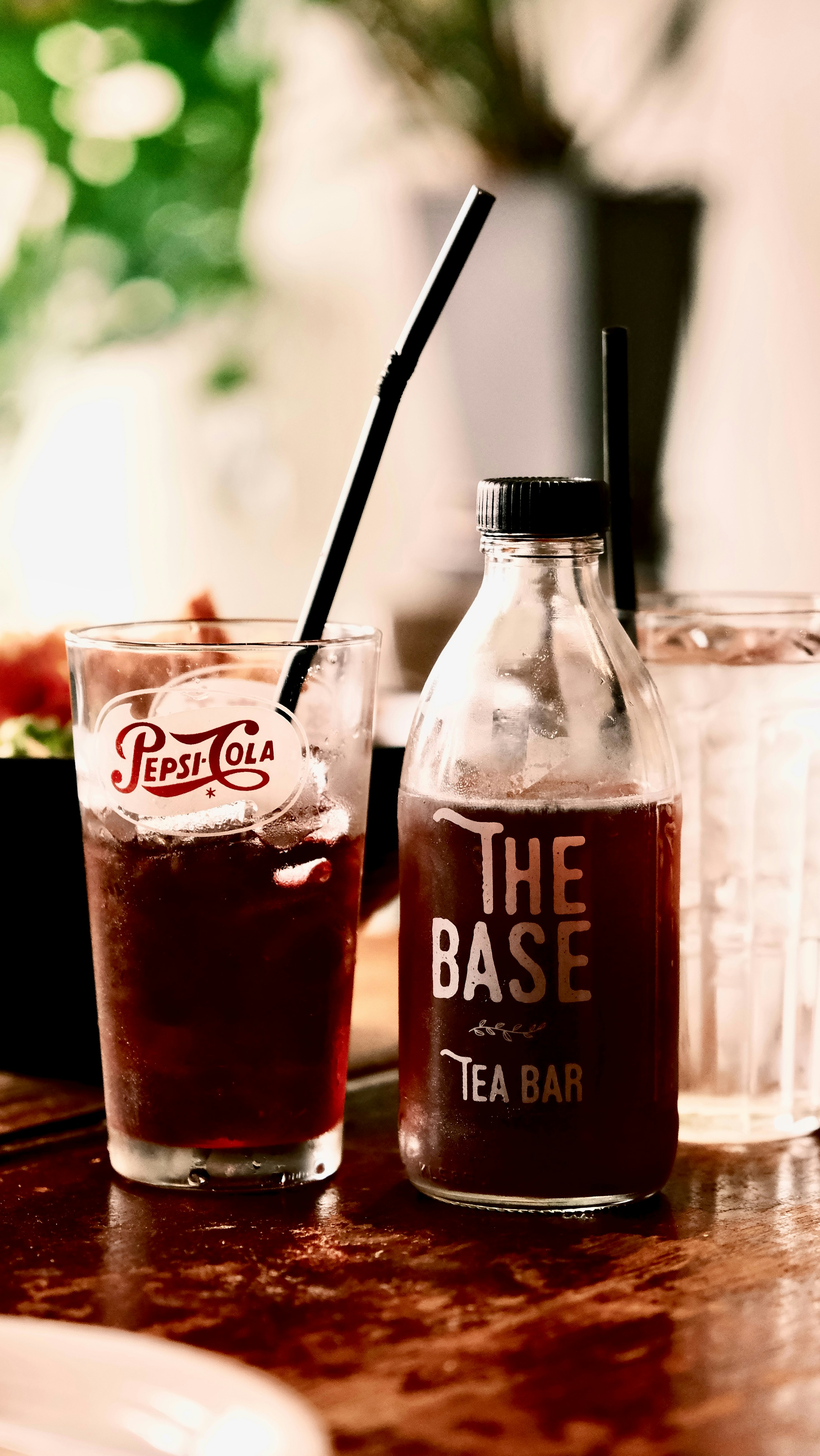The Base of Refreshment: Cola Bottles on a Rustic Counter