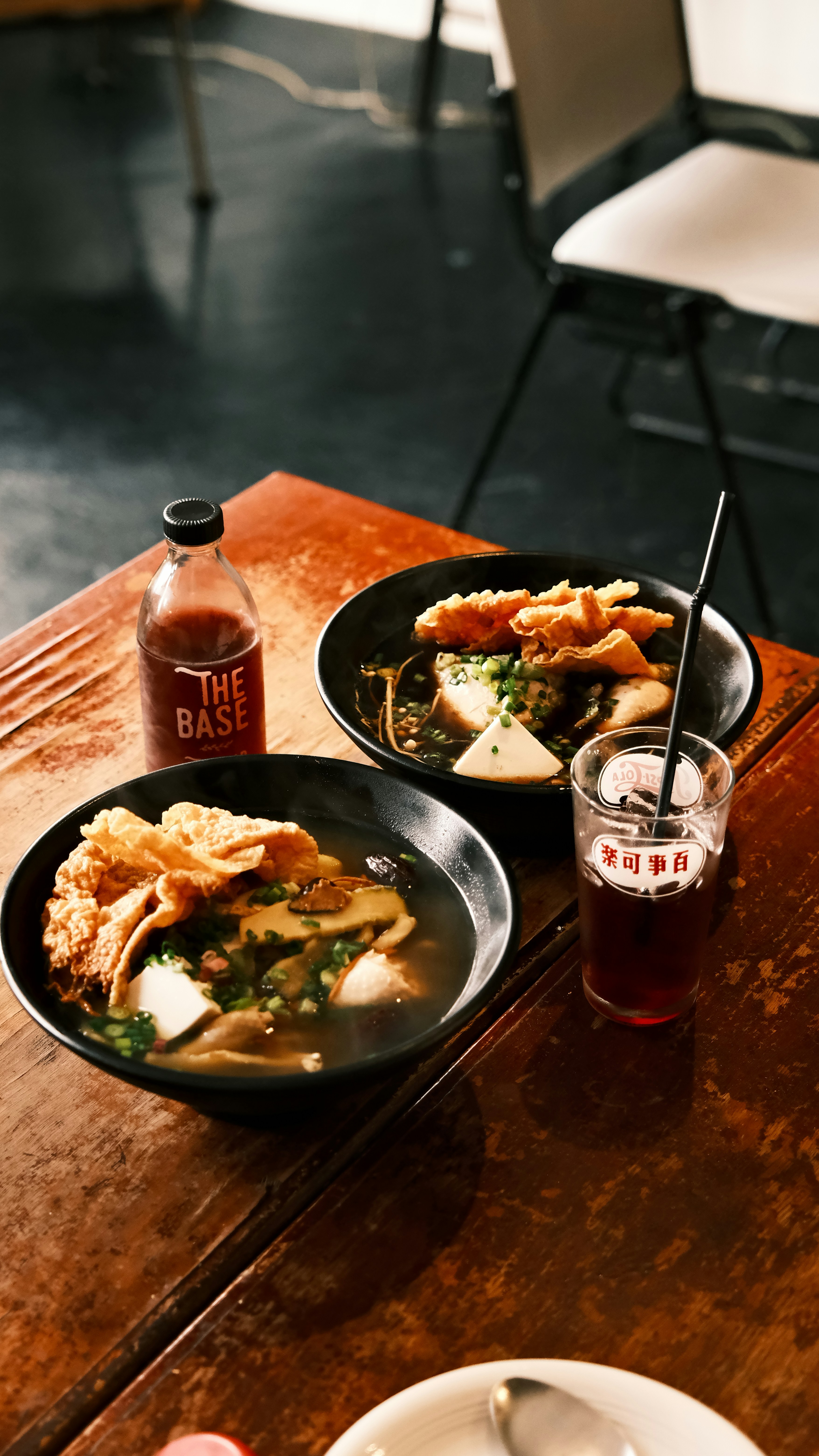 Southern Comfort Bowls: Rich Broth and Crispy Toppings on a Rustic Table