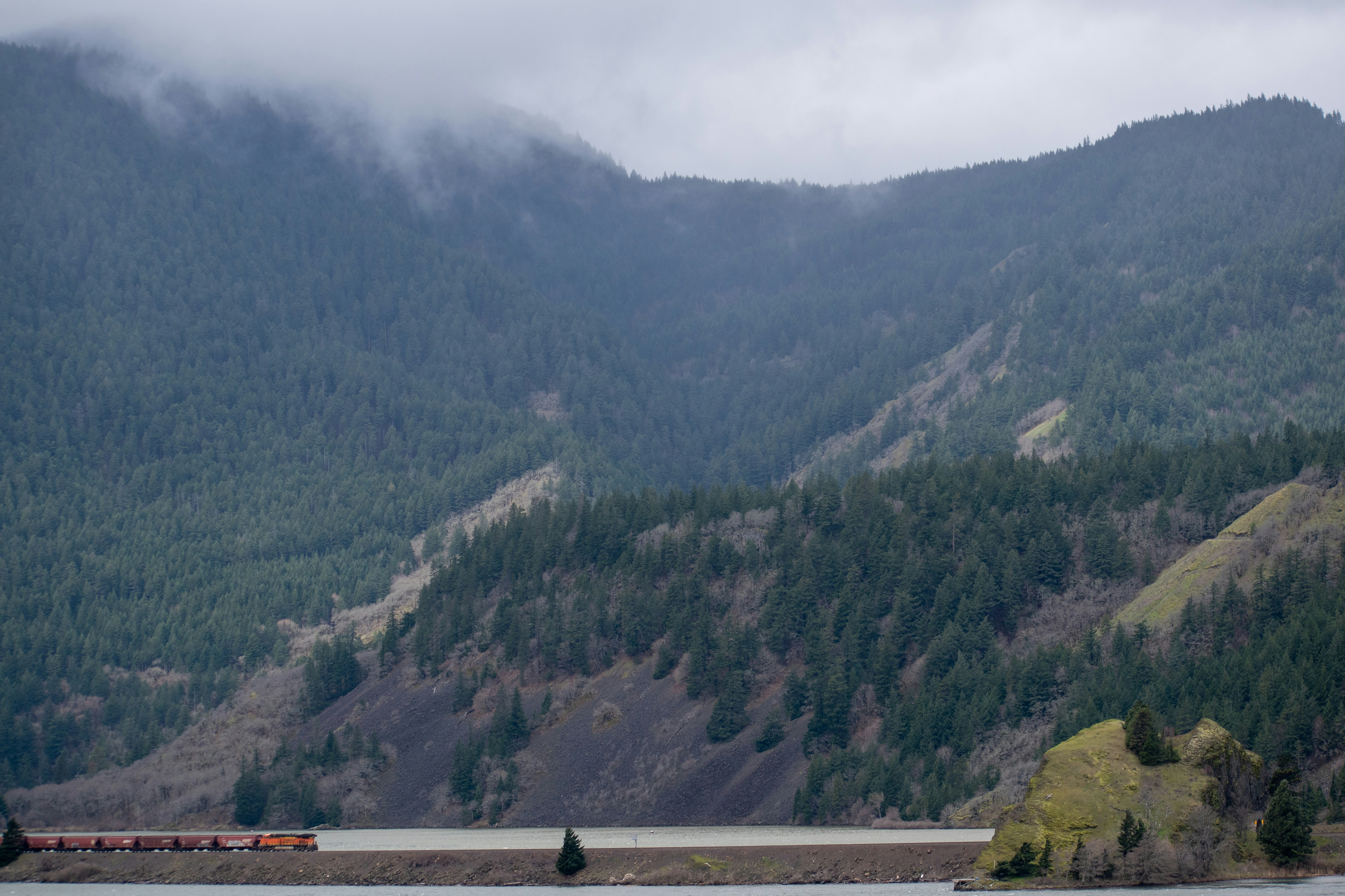 Mist-Cenced Peaks Beside a Tranquil Track