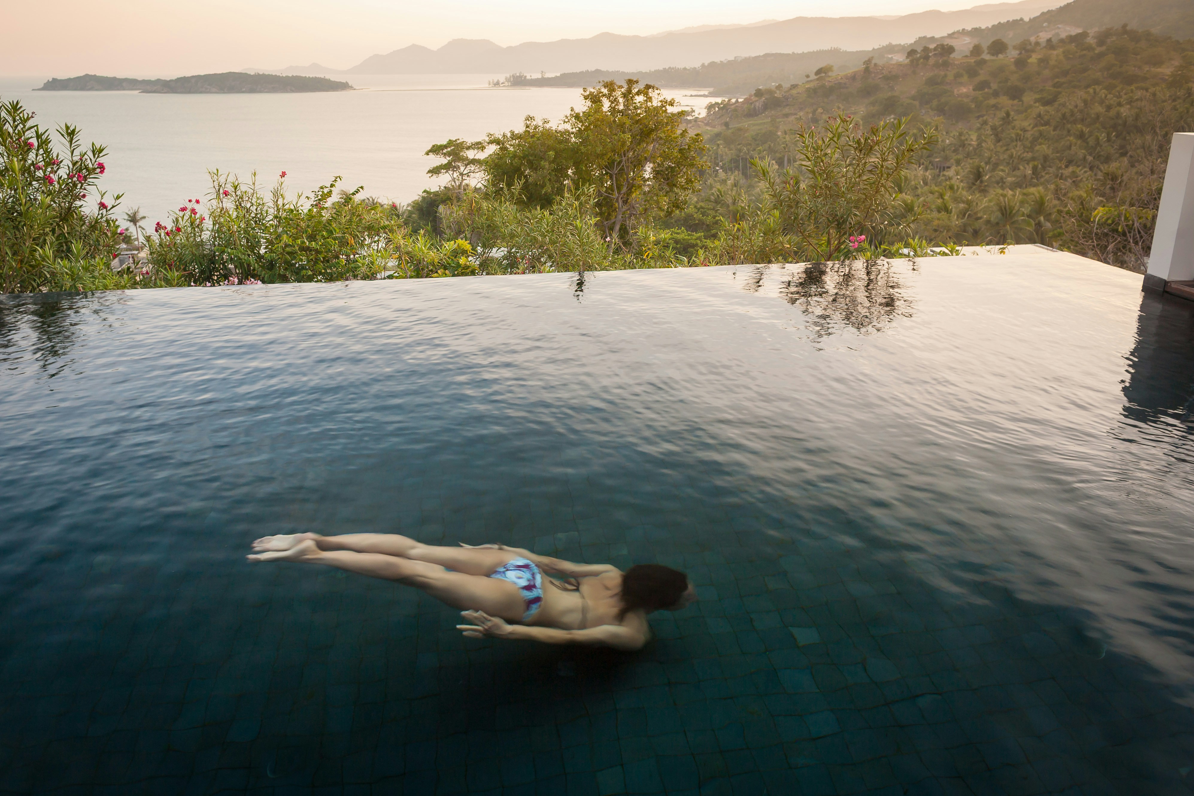 Floating in Silence: A Diver’s Glide Over Velvet Water