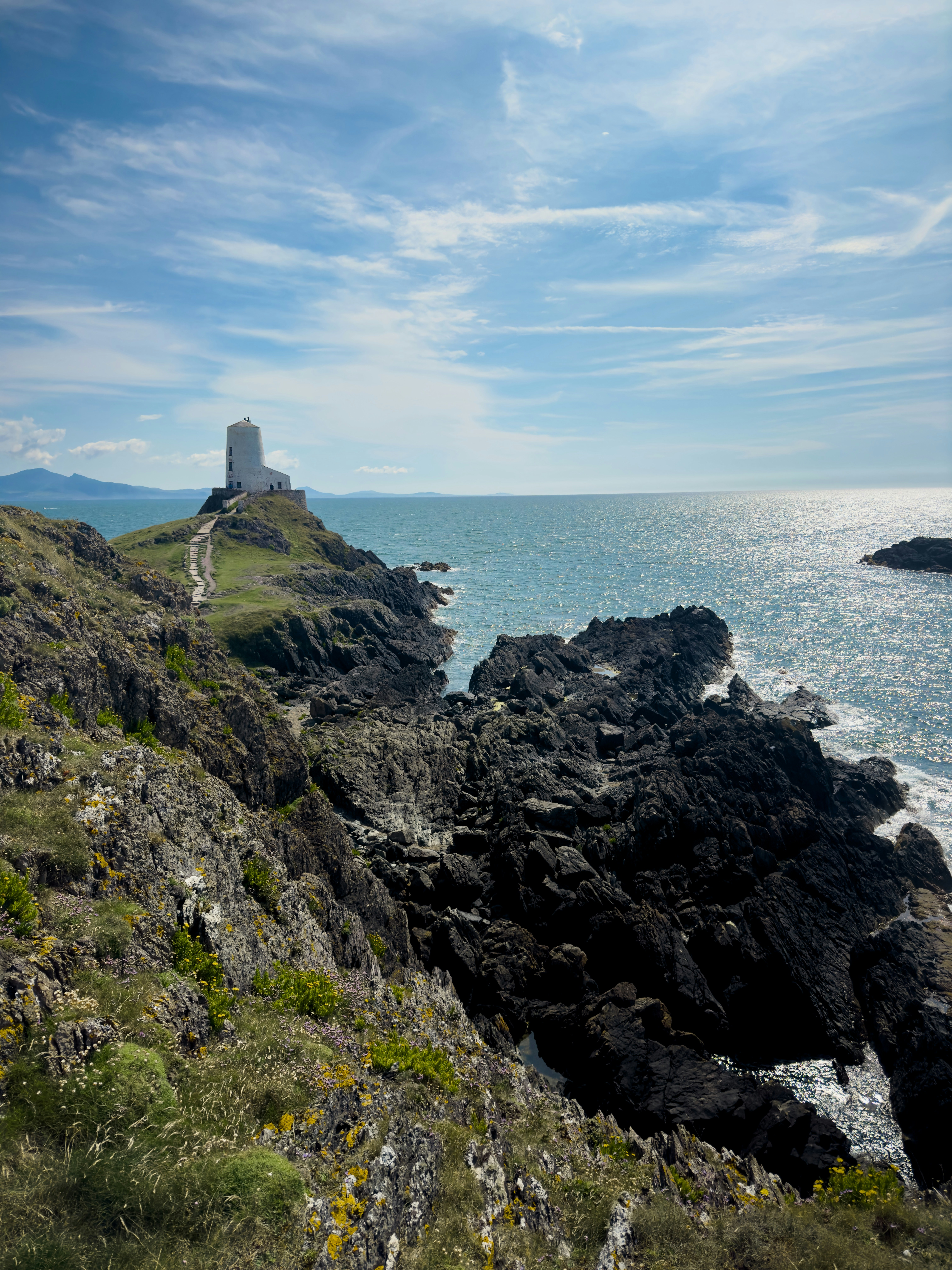 Castle at the Edge: A Cliffside Beacon Over Turquoise Waters