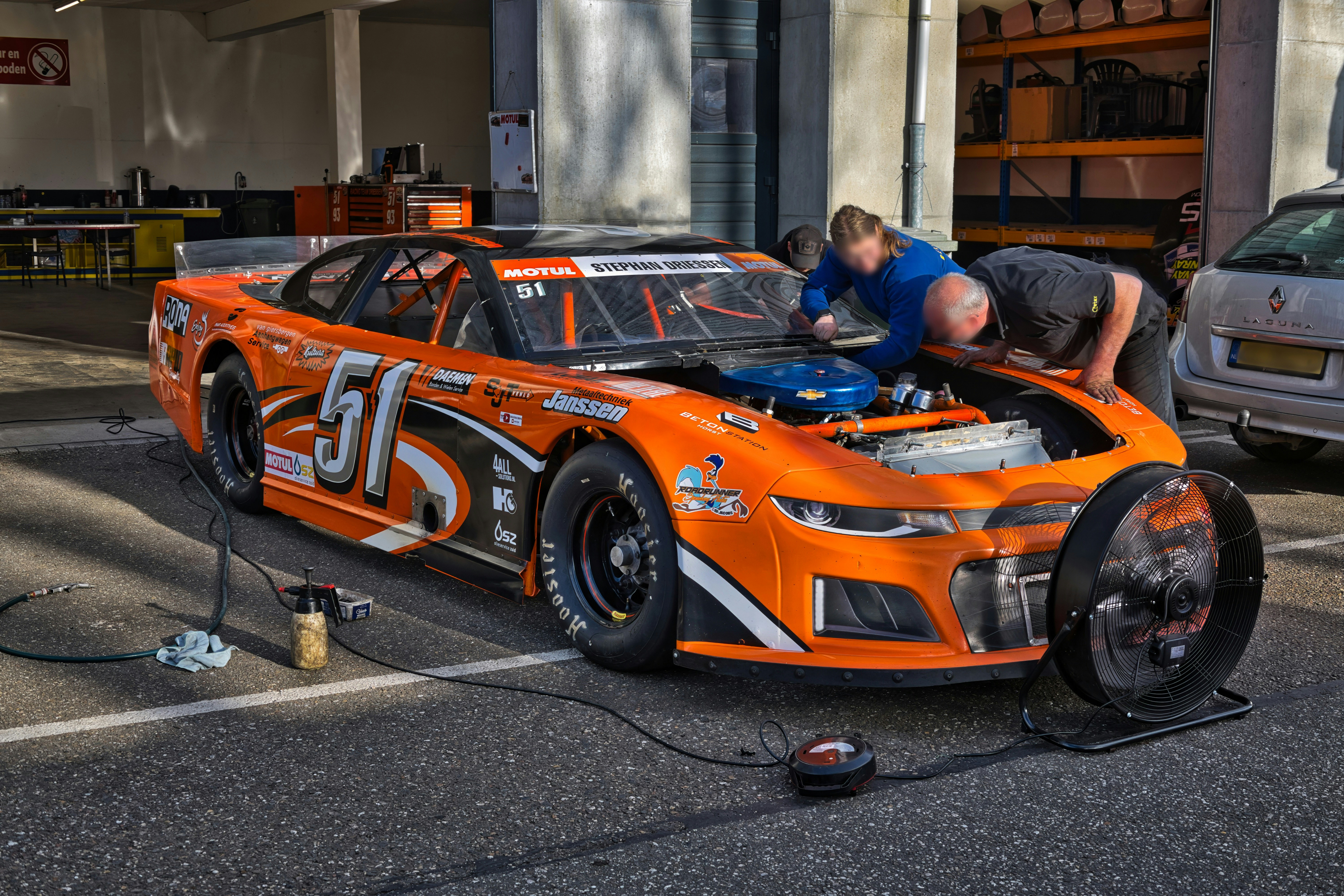 Engine Bay Reveal: The Orange Racer in the Pits