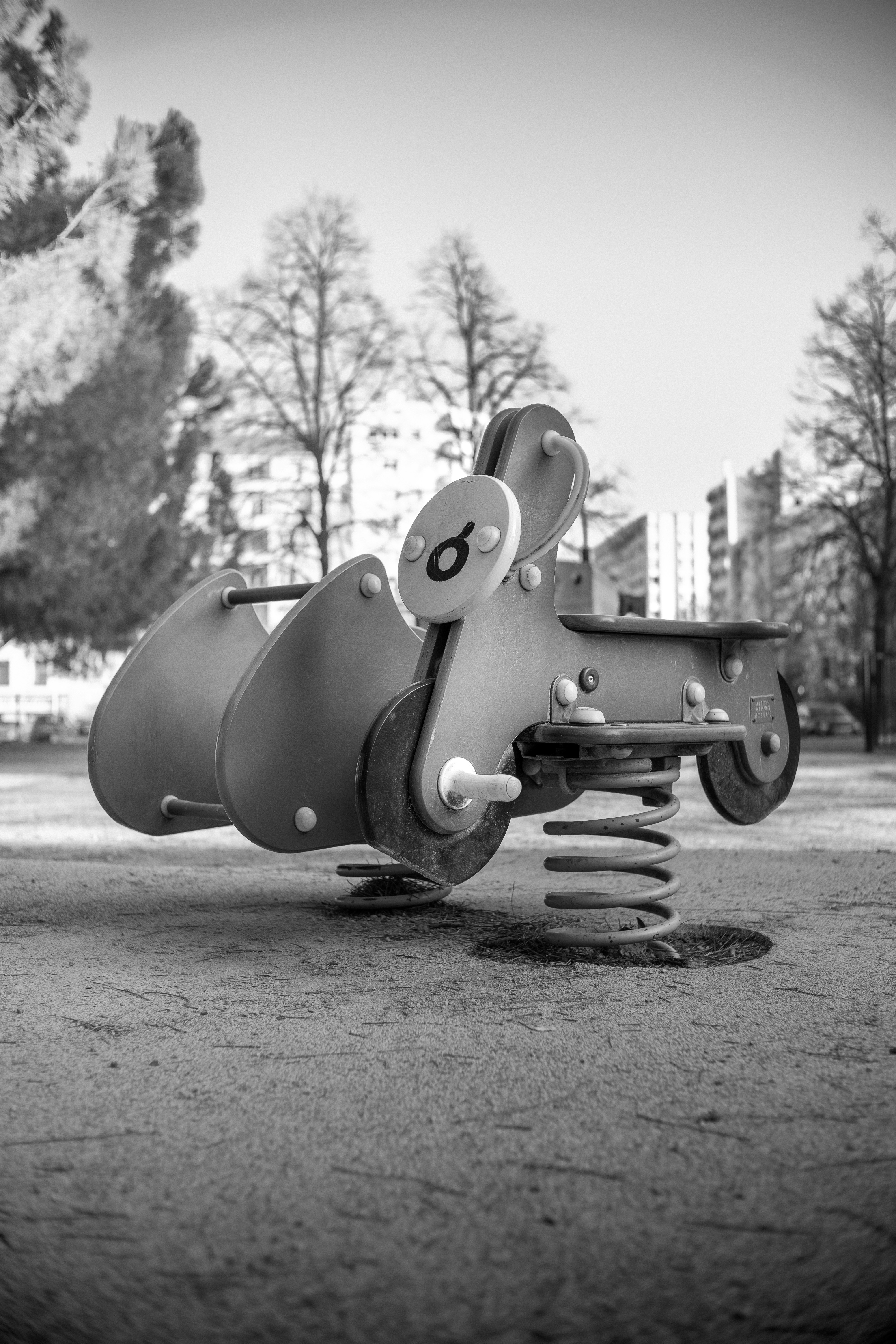 Windswept Playground: A Quiet Coil of Steel and Sand