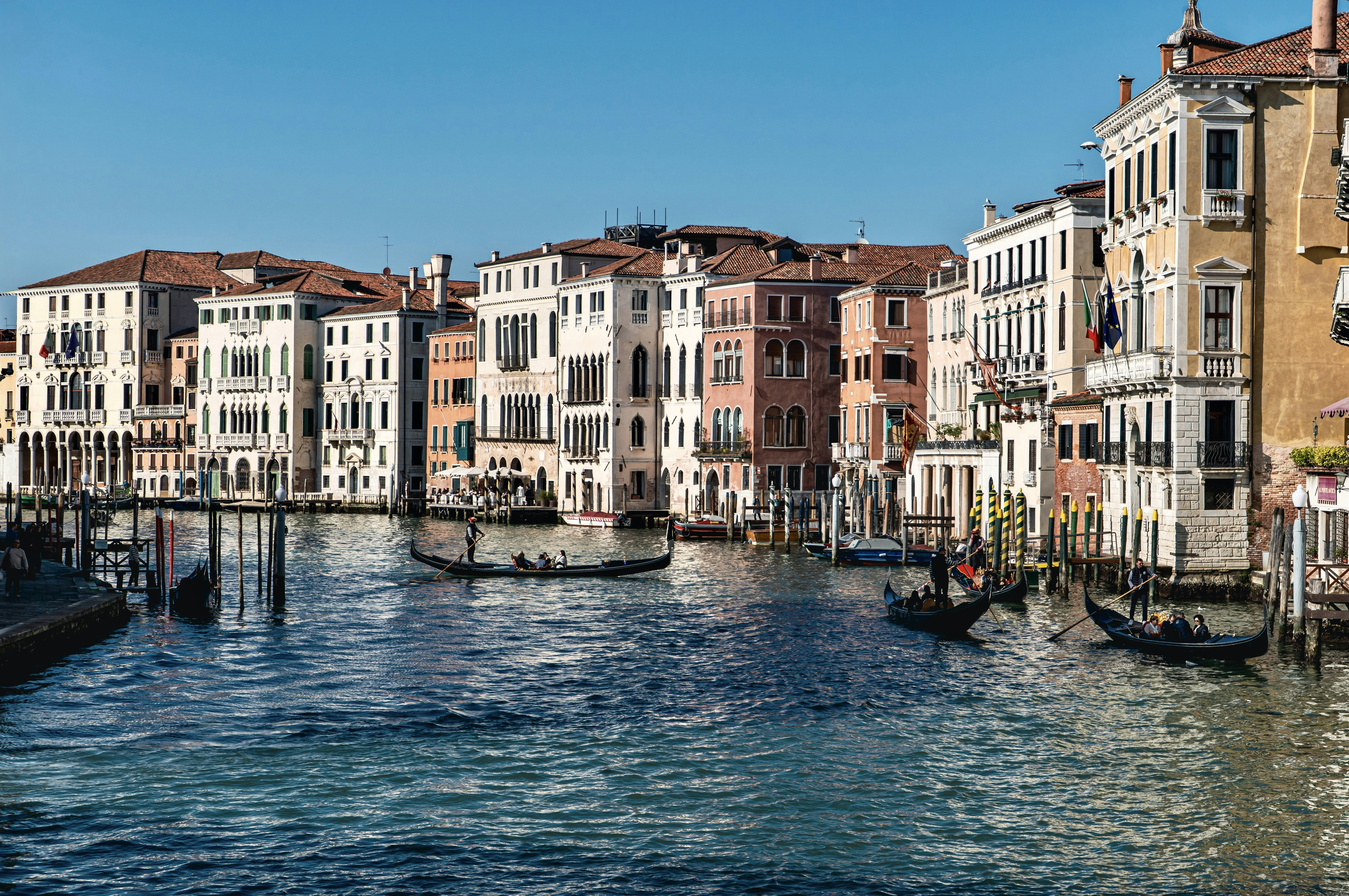 Venetian Canal Portrait: Bright Facades and Moving Gondolas