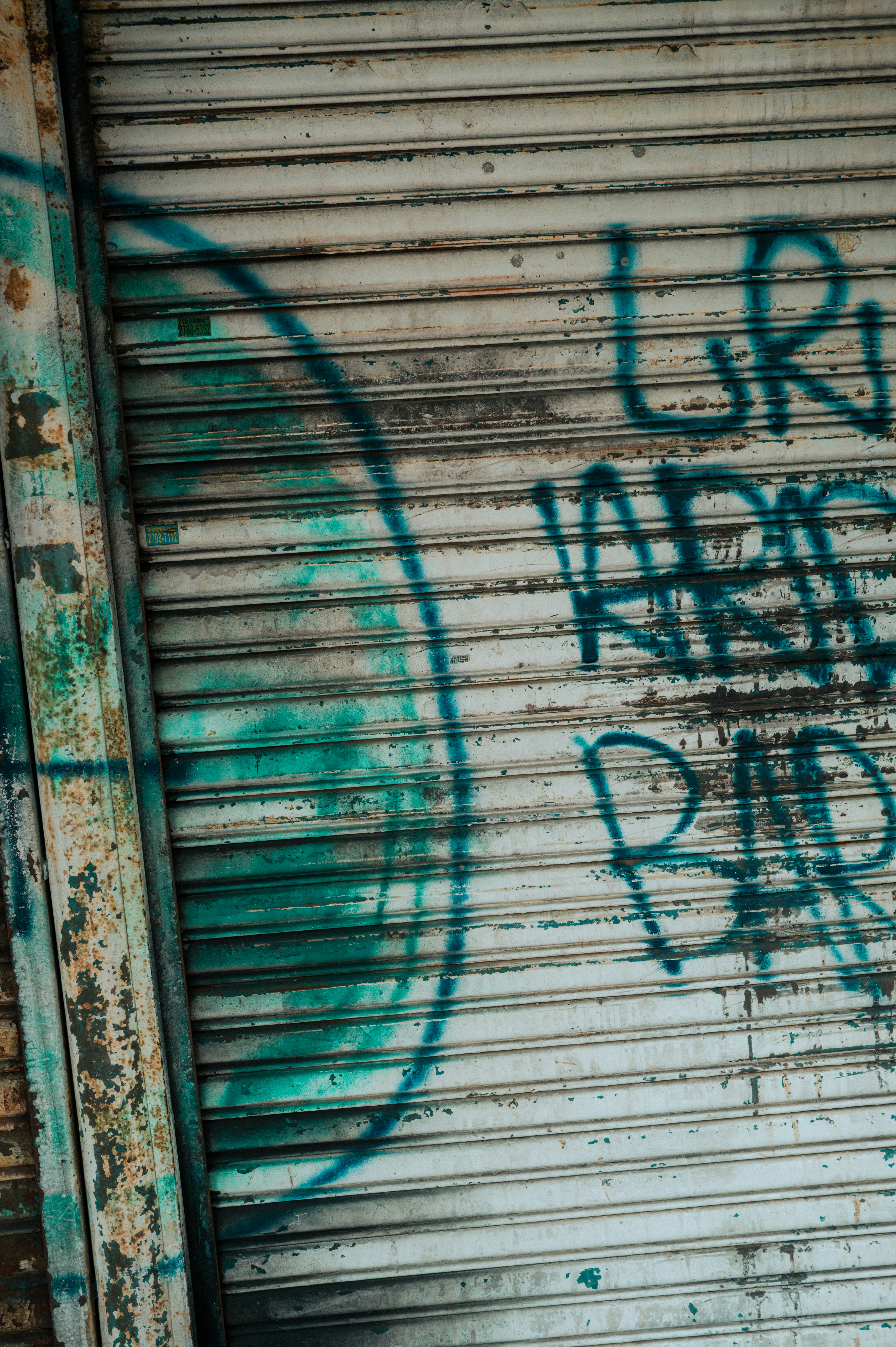 Graffiti-Ced Wall: Moonlit Stripe of Steel