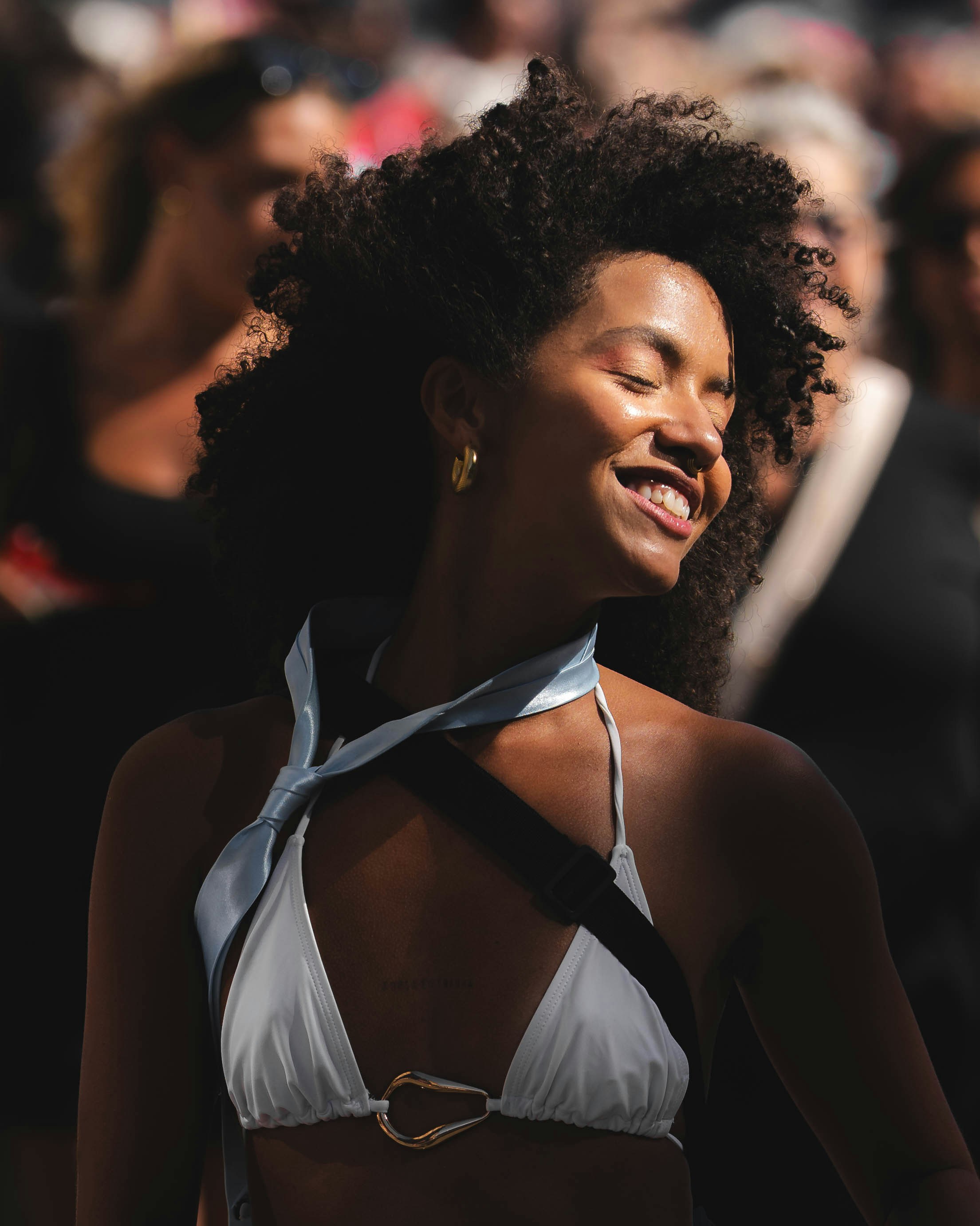 Joyful Glow: A Sunlit Moment with a Dancing Smile