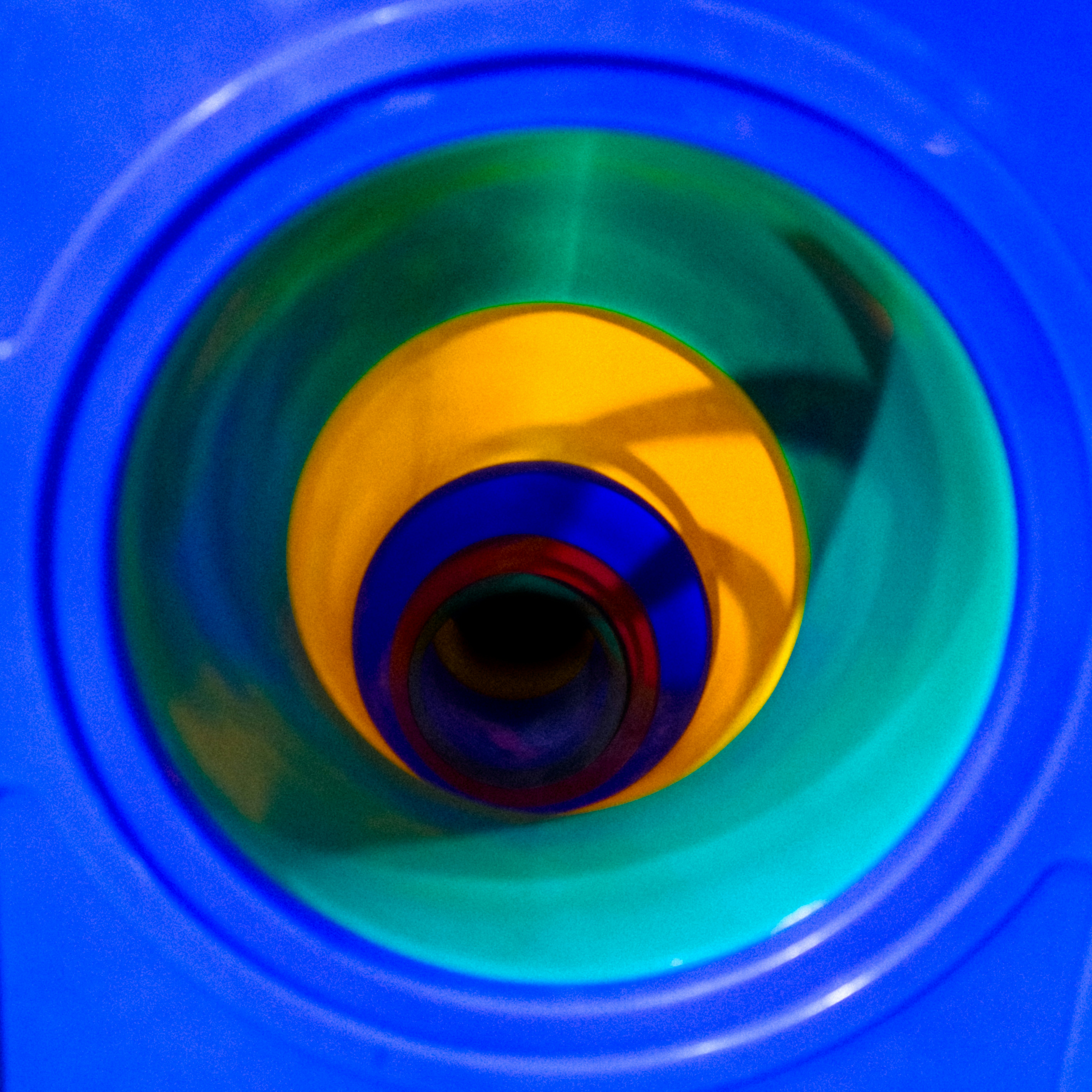 Colorful Spiral Tunnel: Abstract Vortex Within a Circular Slide