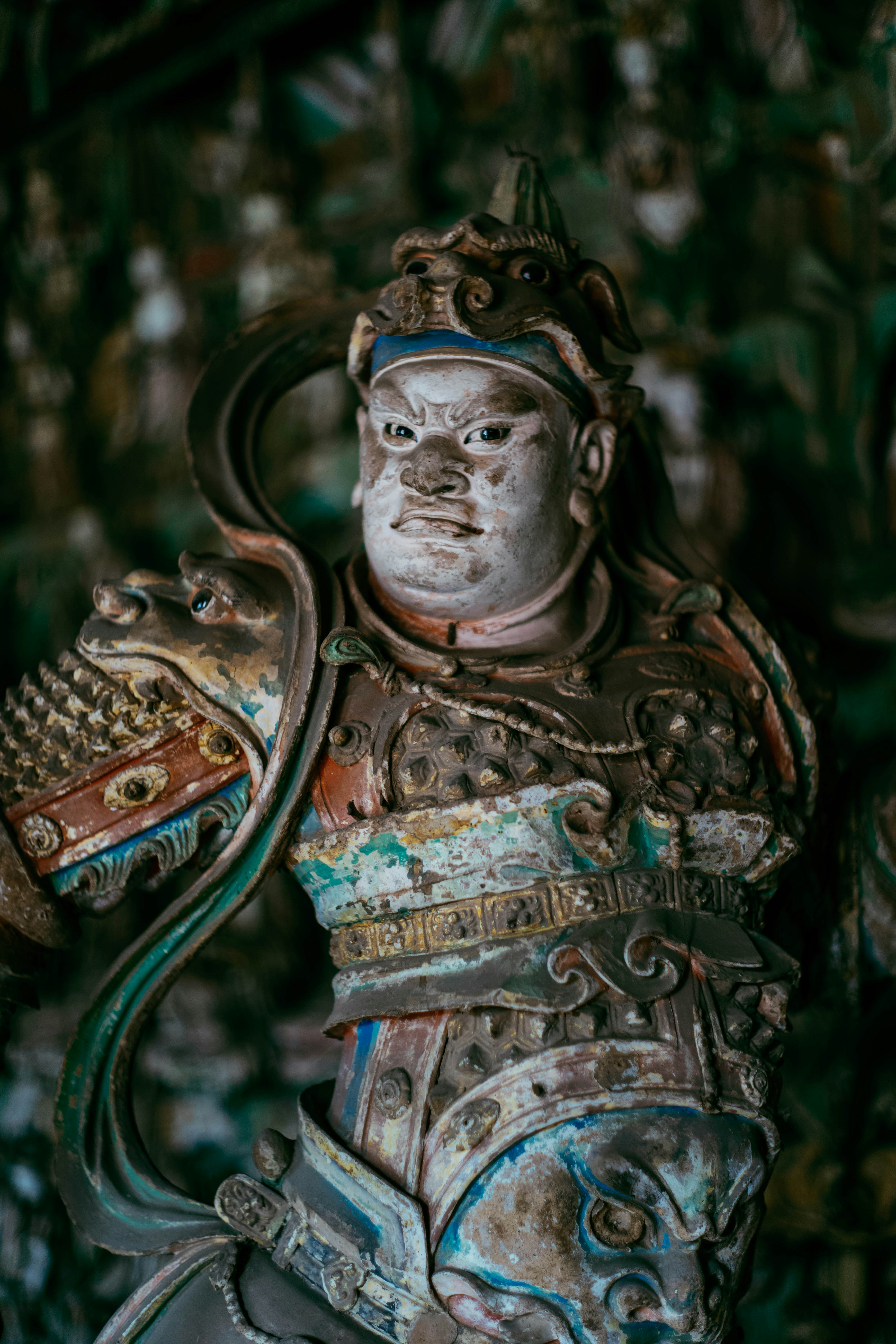 Ancient Warrior Saint: Weathered Armor and Guarded Gaze