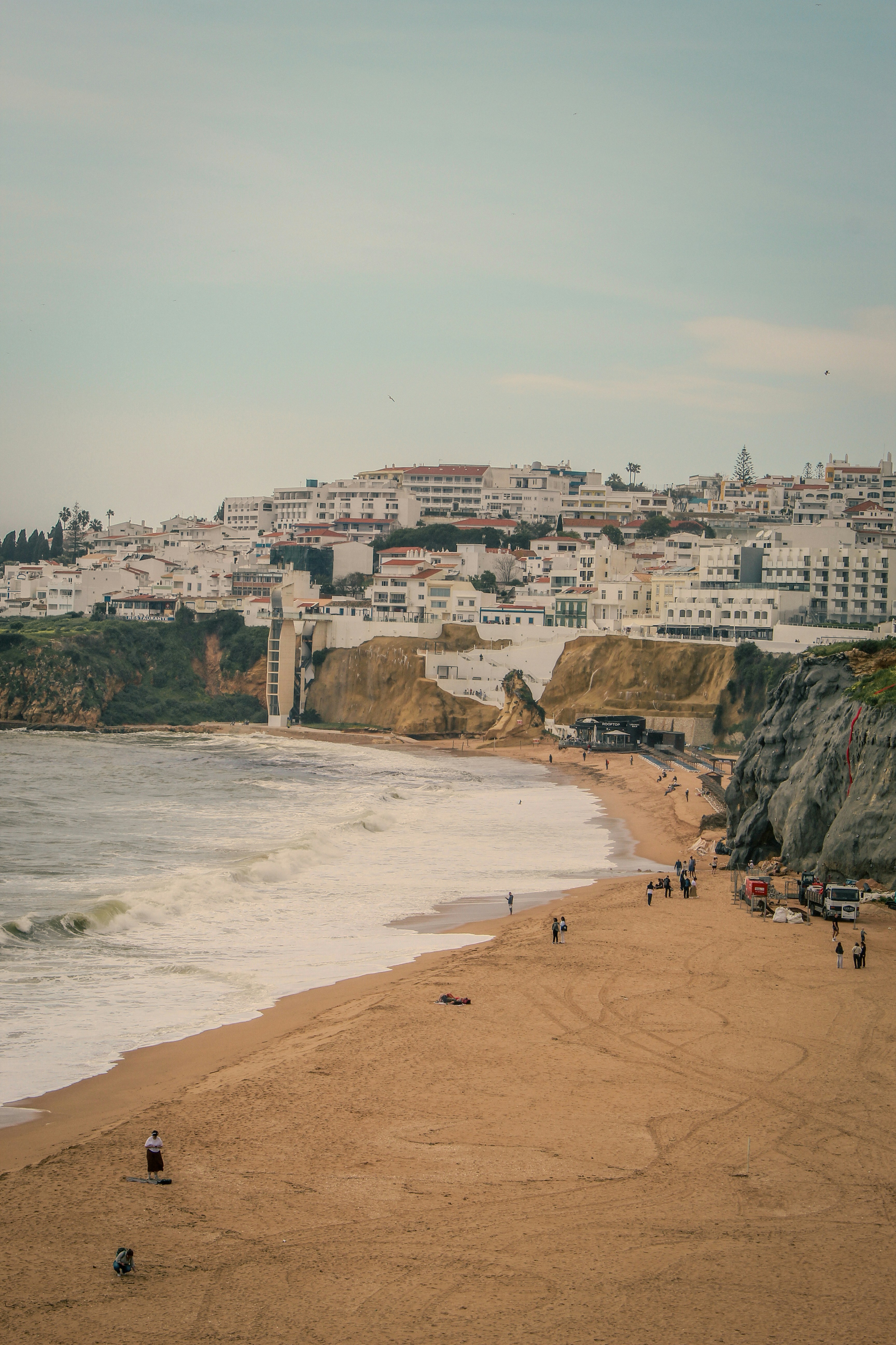 Coastal Cityscape: Beach Curve Meets Cliffside Homes