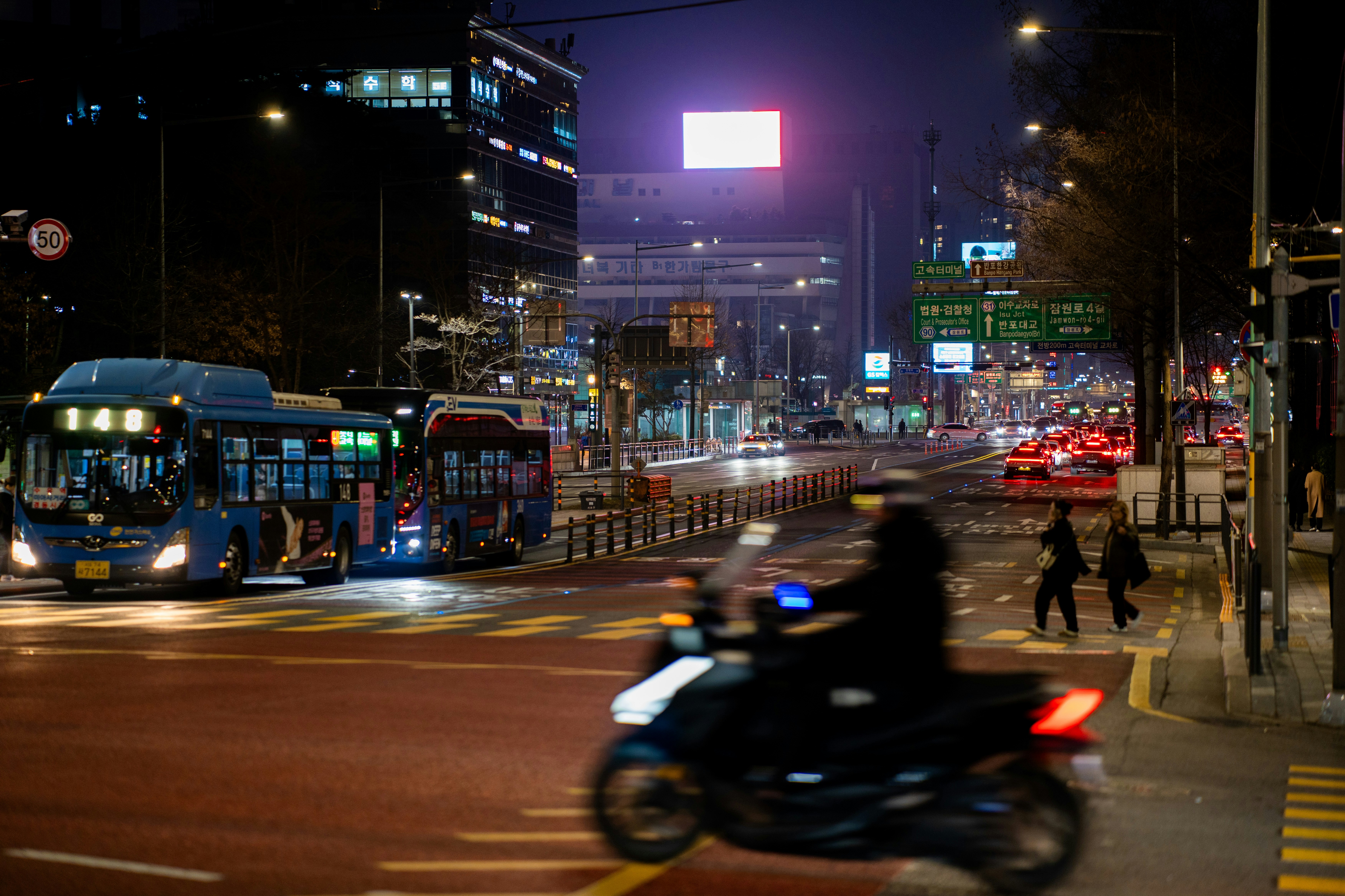 Neon Traffic Pulse: Night Bus Route Through a Lively City