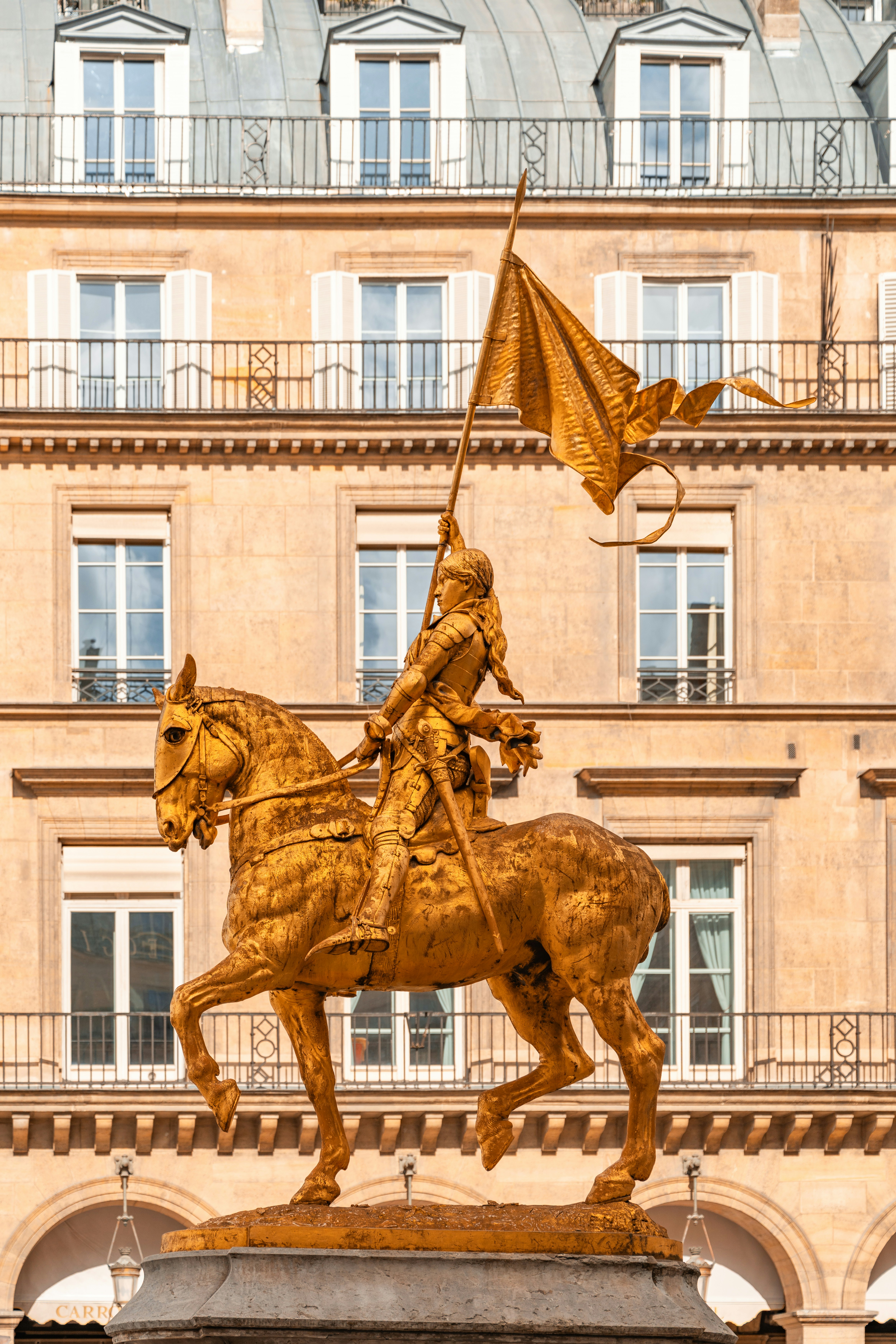 Bronze Knight on Horseback Guarding a Sunlit Facade