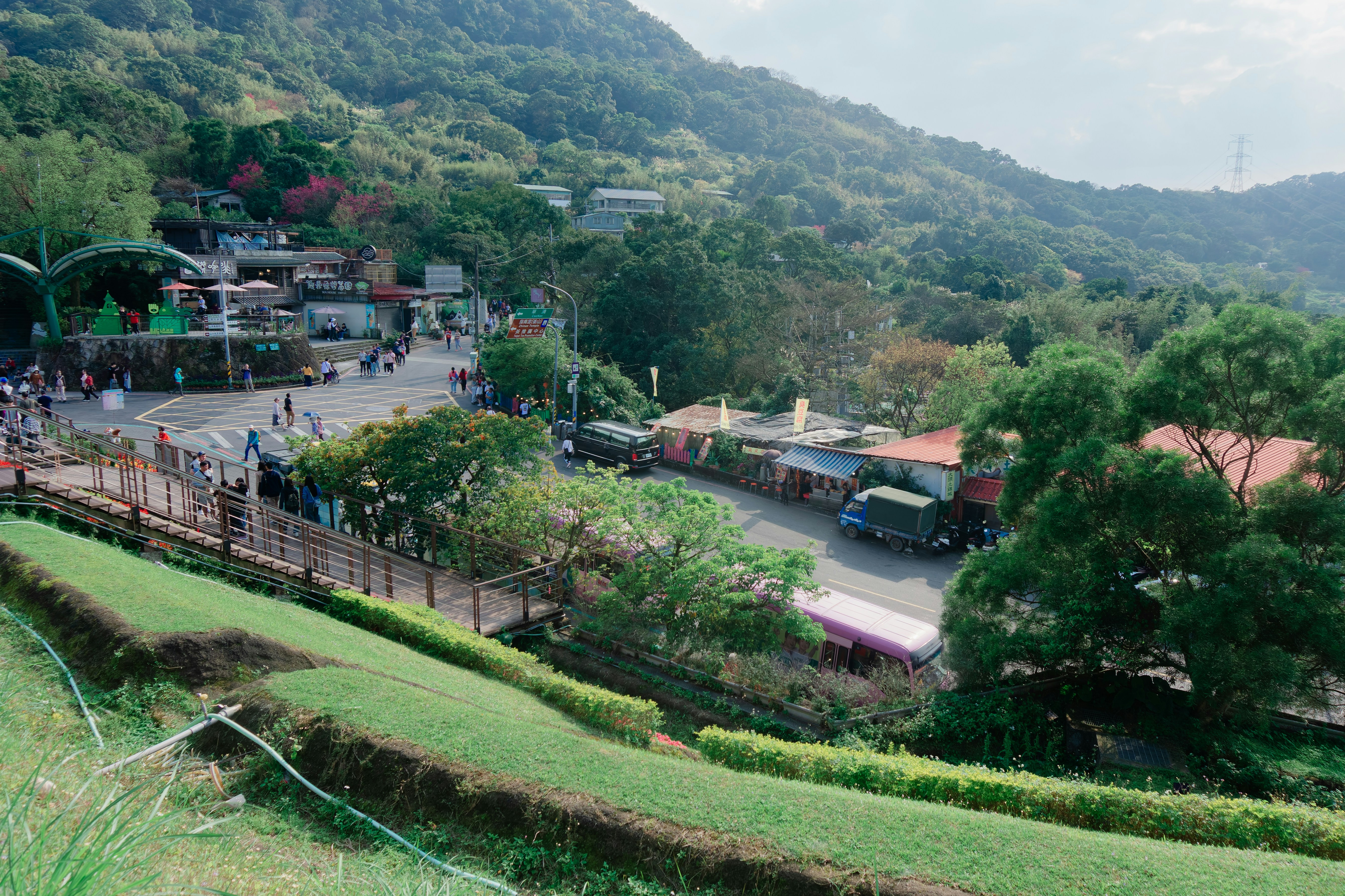 Terraced Park Amid Hilltop Village and Market Stalls