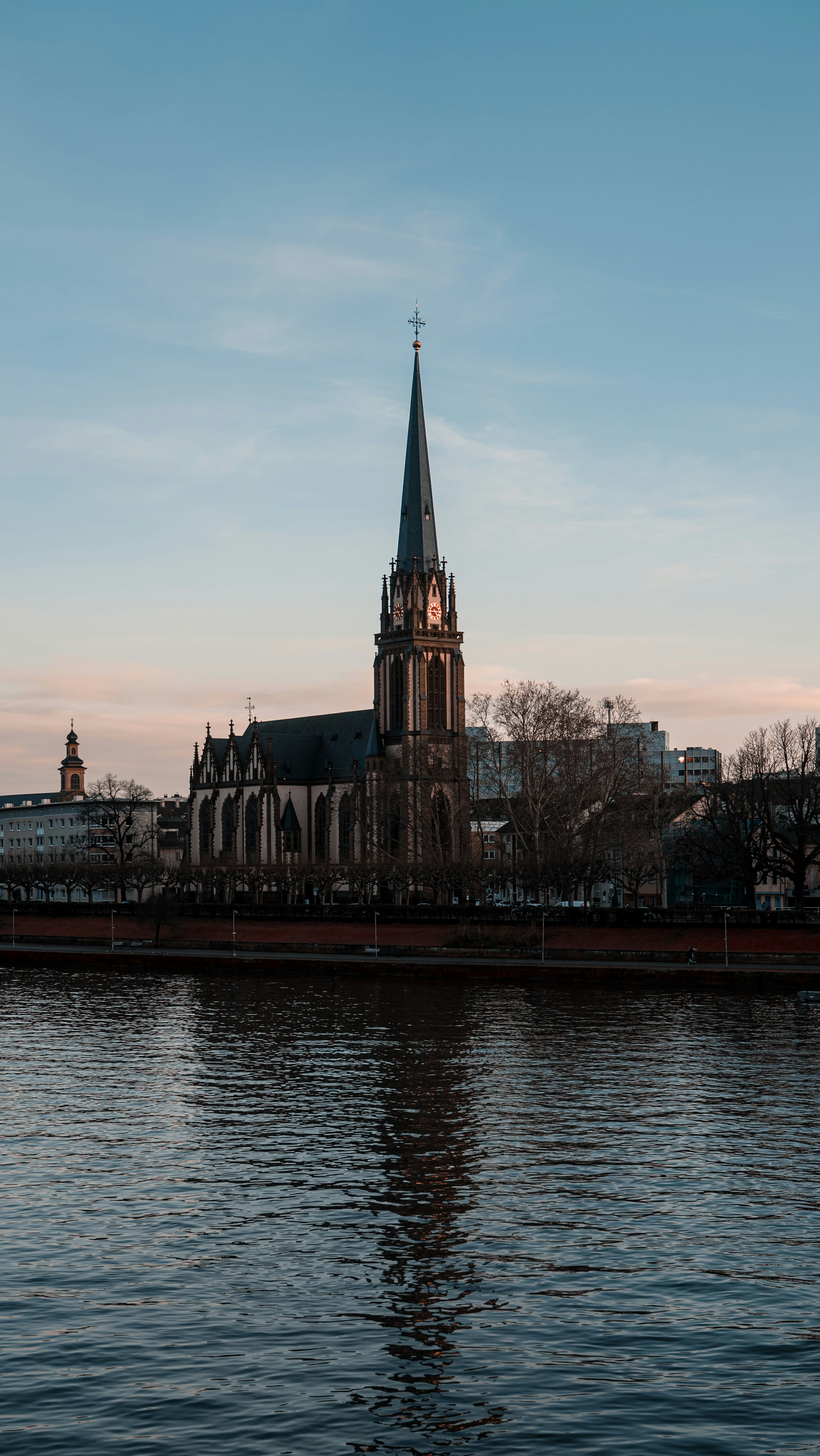 Stained Spire at Dusk Over the River