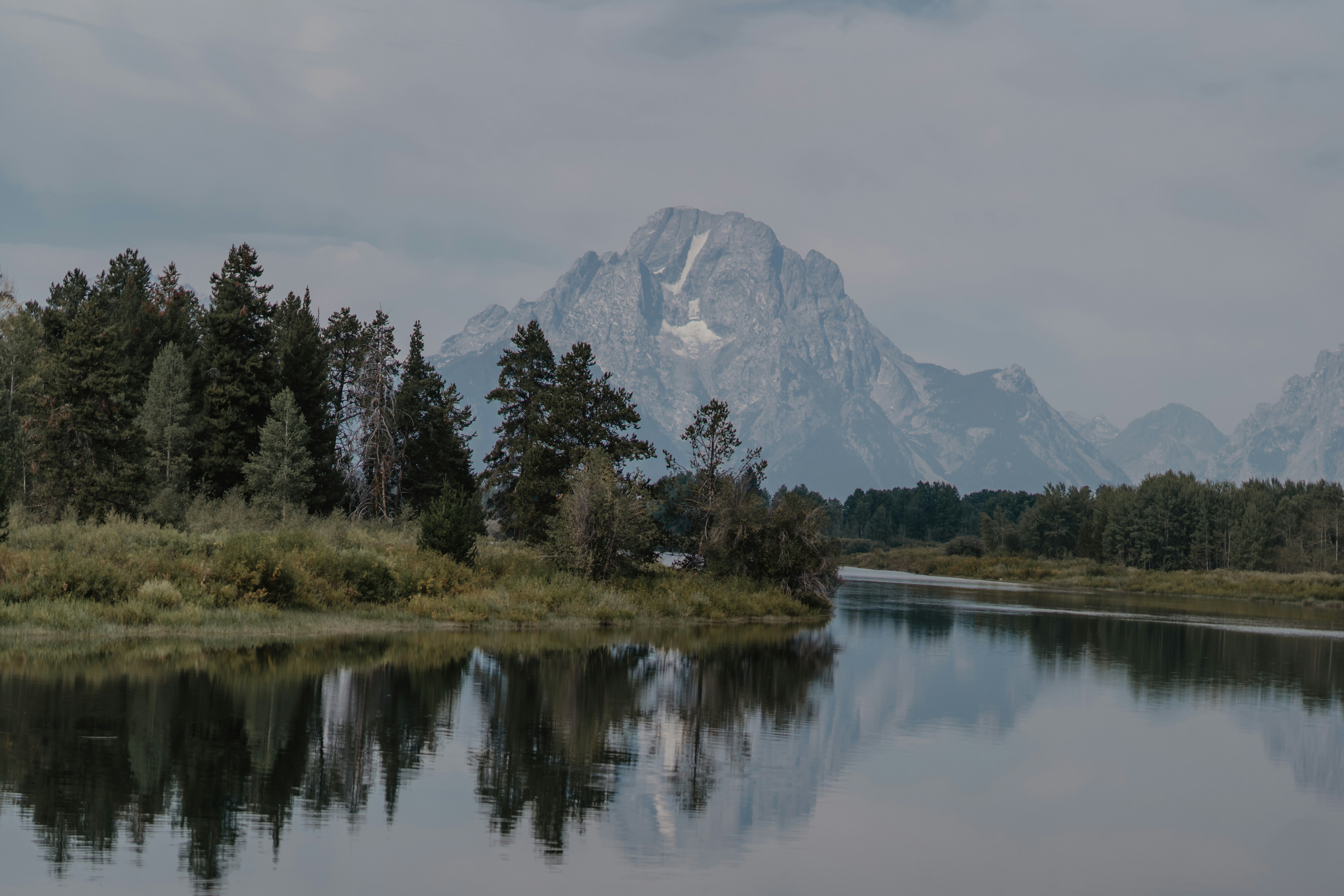 Mirror of Peaks: Lake, Trees, and a Snow-Capped Summit