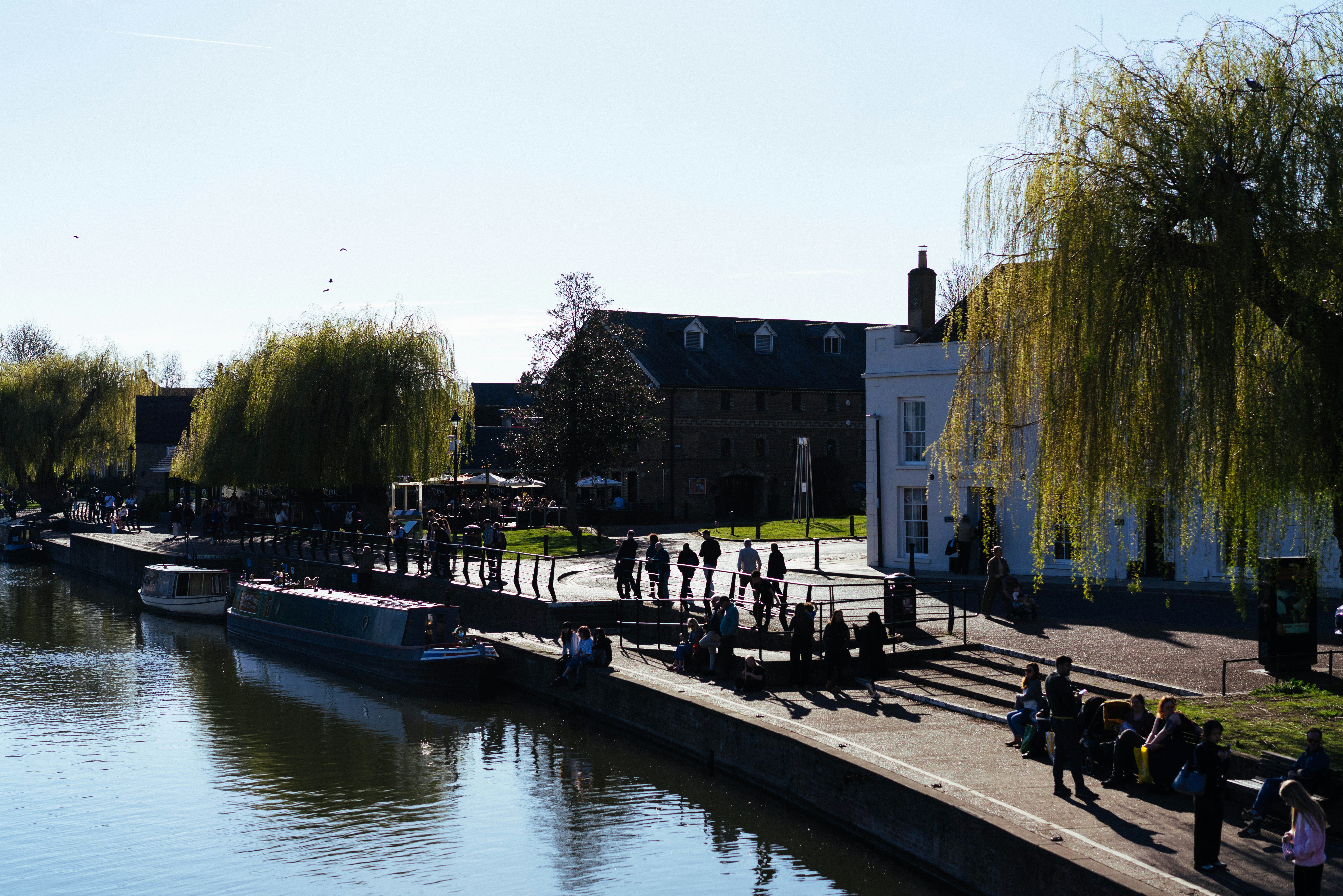 Riverside Stroll and Shadowed Promenade