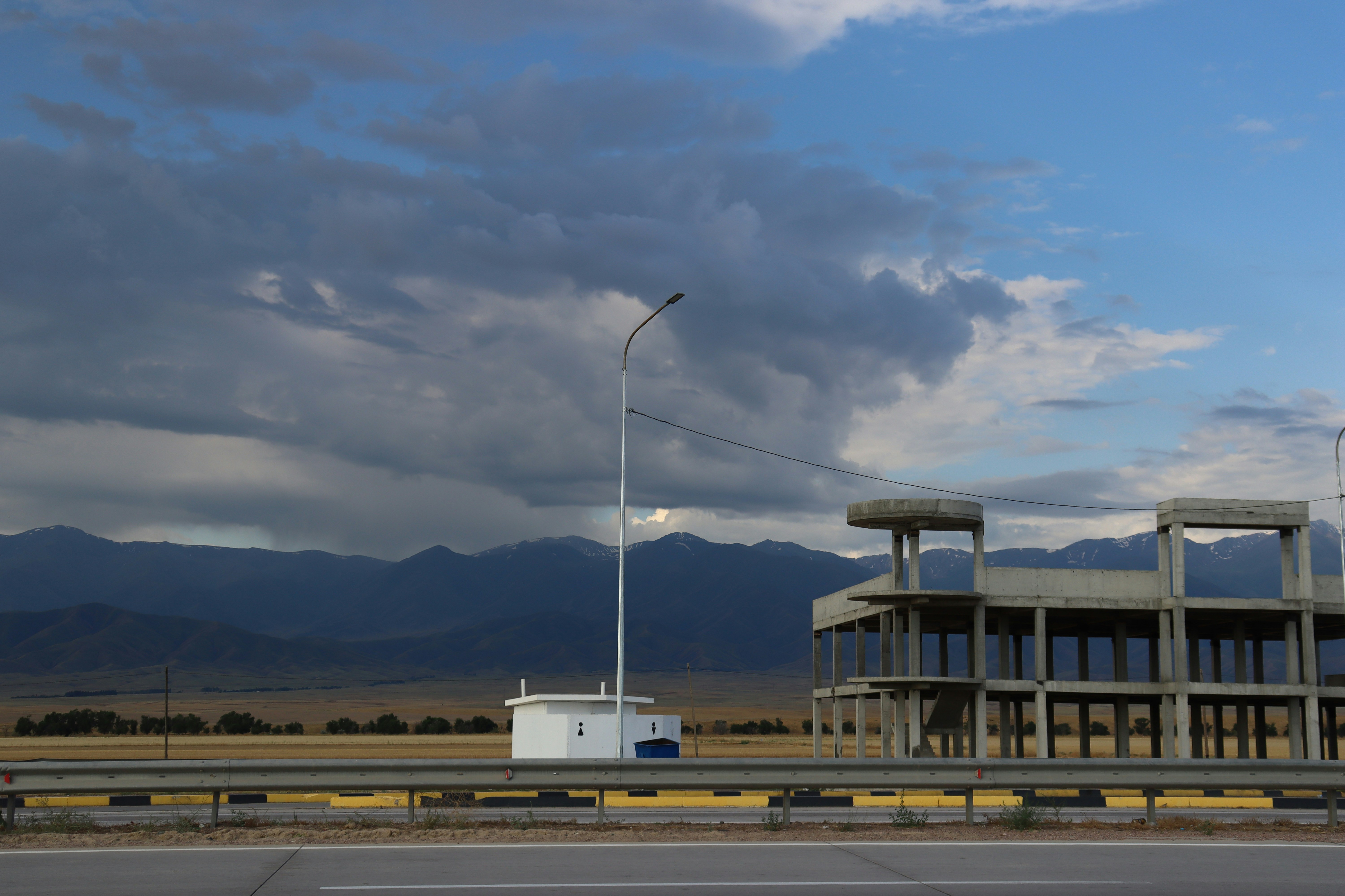 Desolate Runway Edge Under Expansive Sky