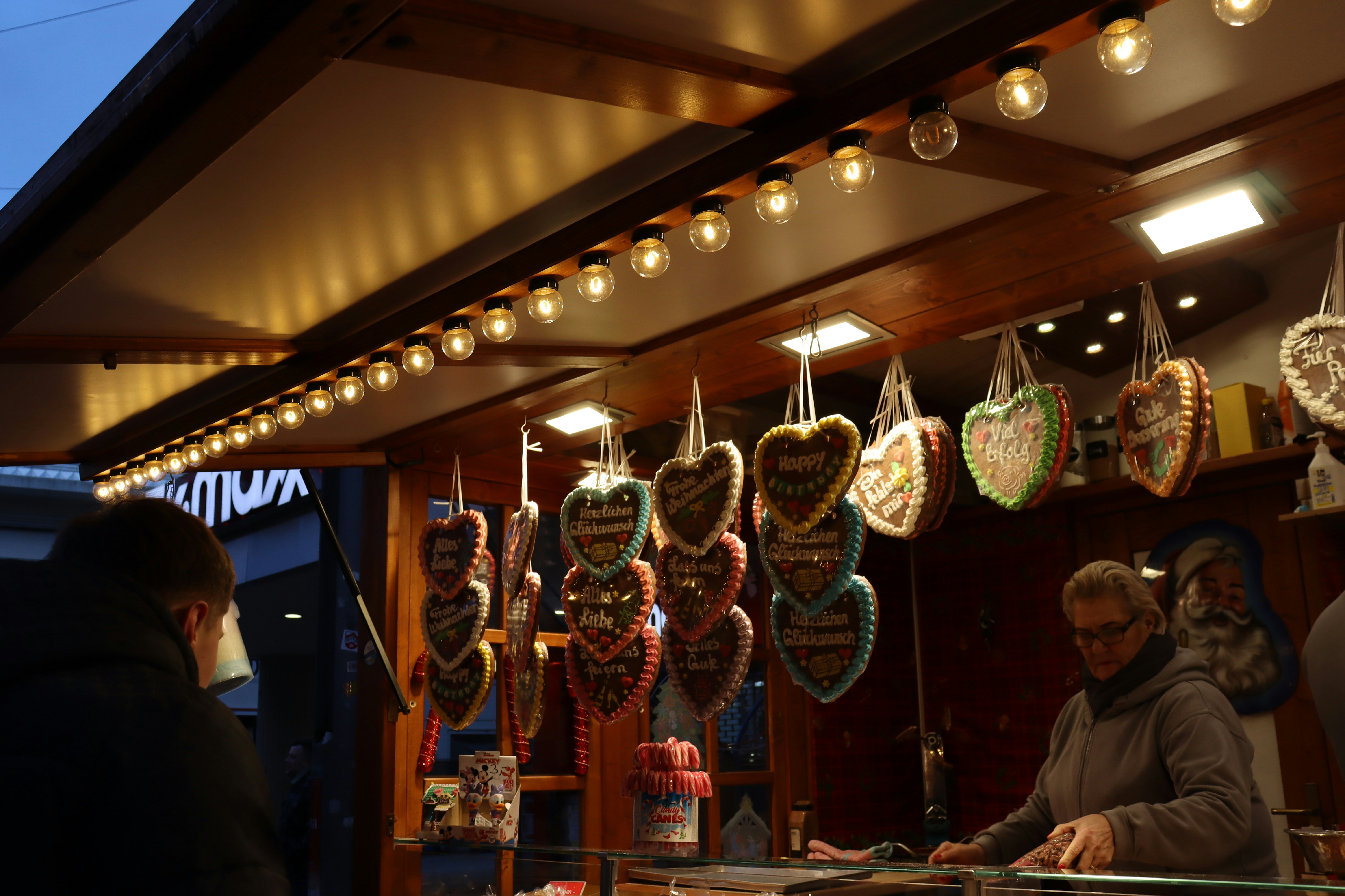 Candy-Heart Lights: A Glowing Market Stall at Dusk