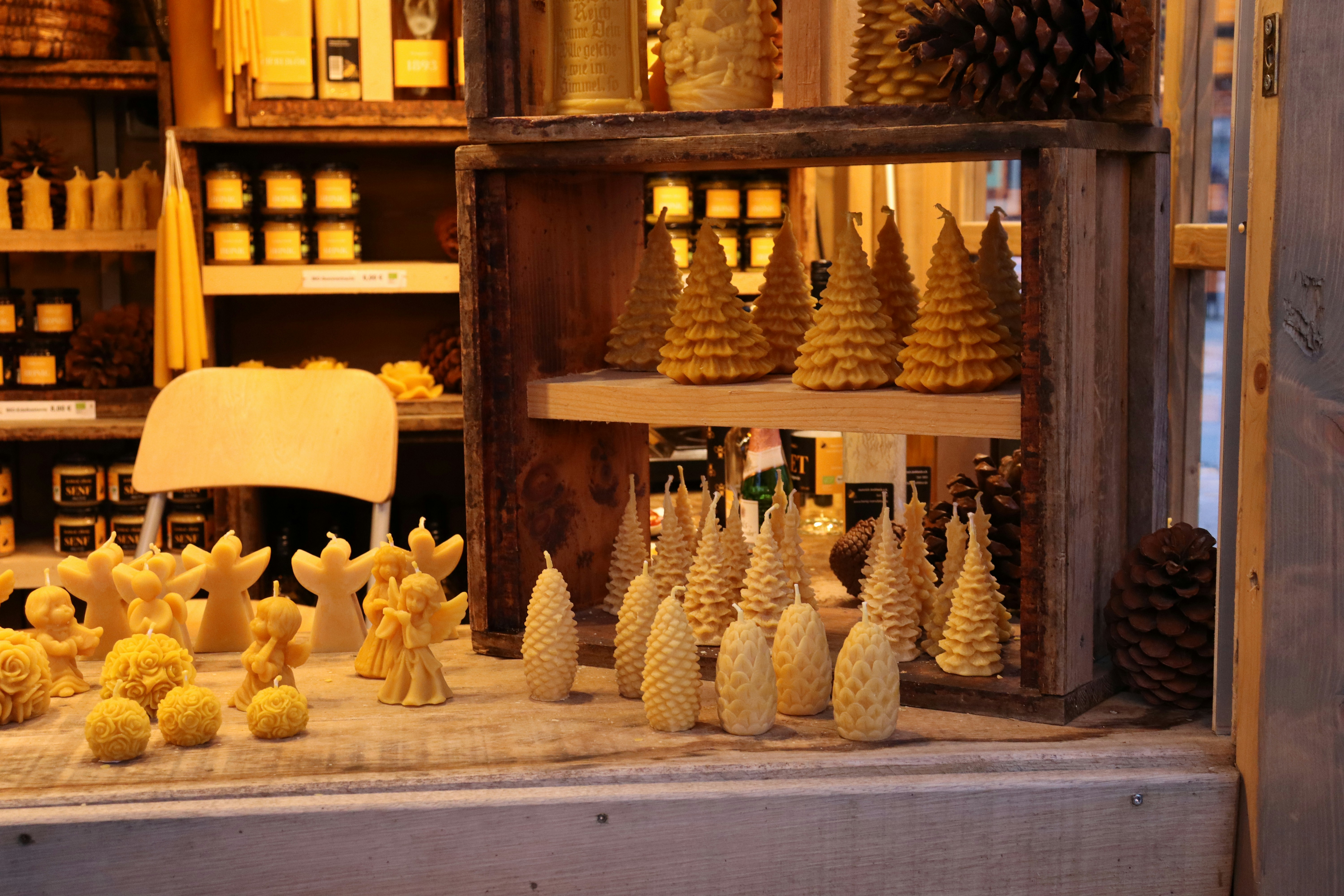 Waxen Forest of Candled Cones on a Rustic Window Shelf