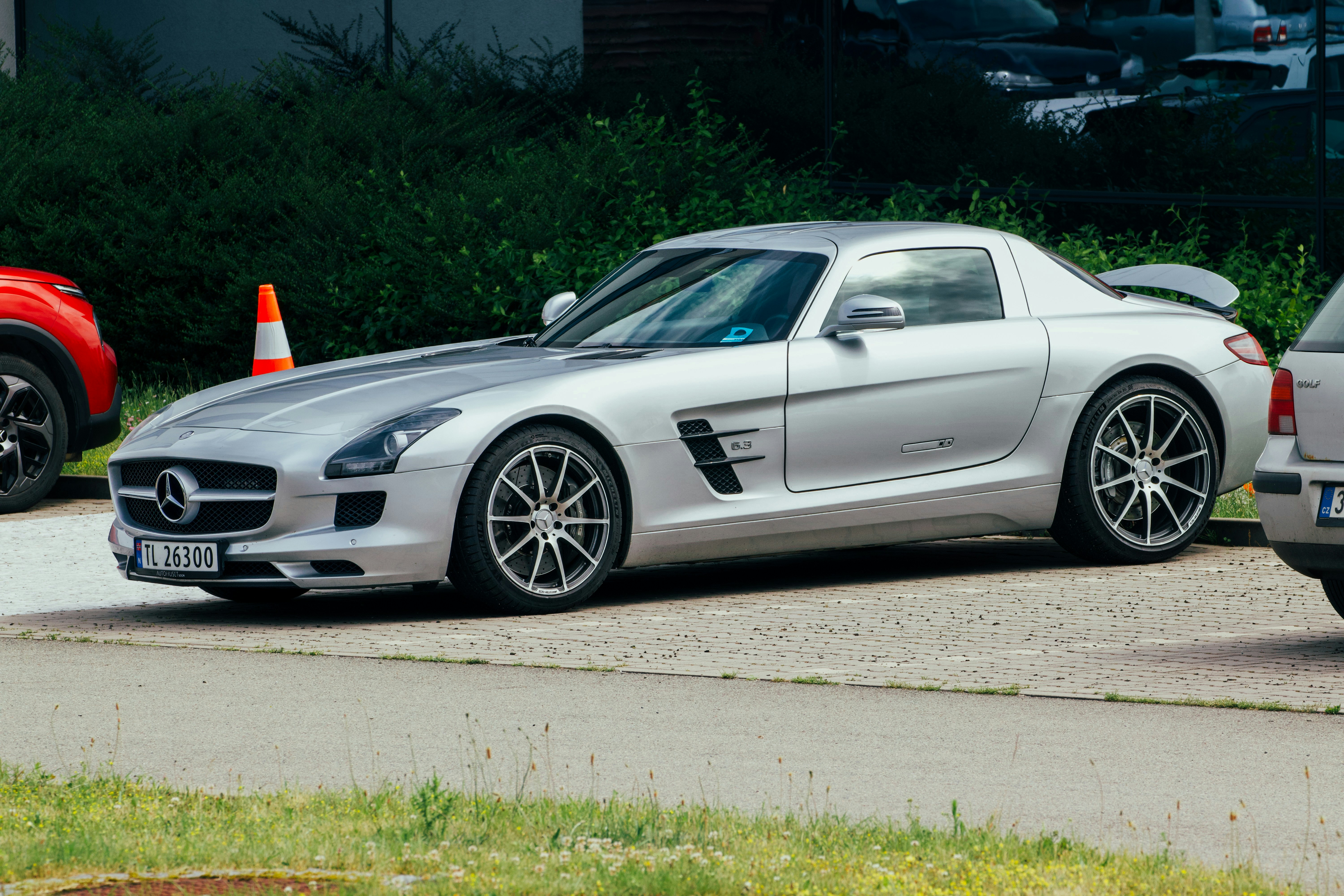 Silver Mercedes SLR-inspired Sports Coupe in Parking Lot