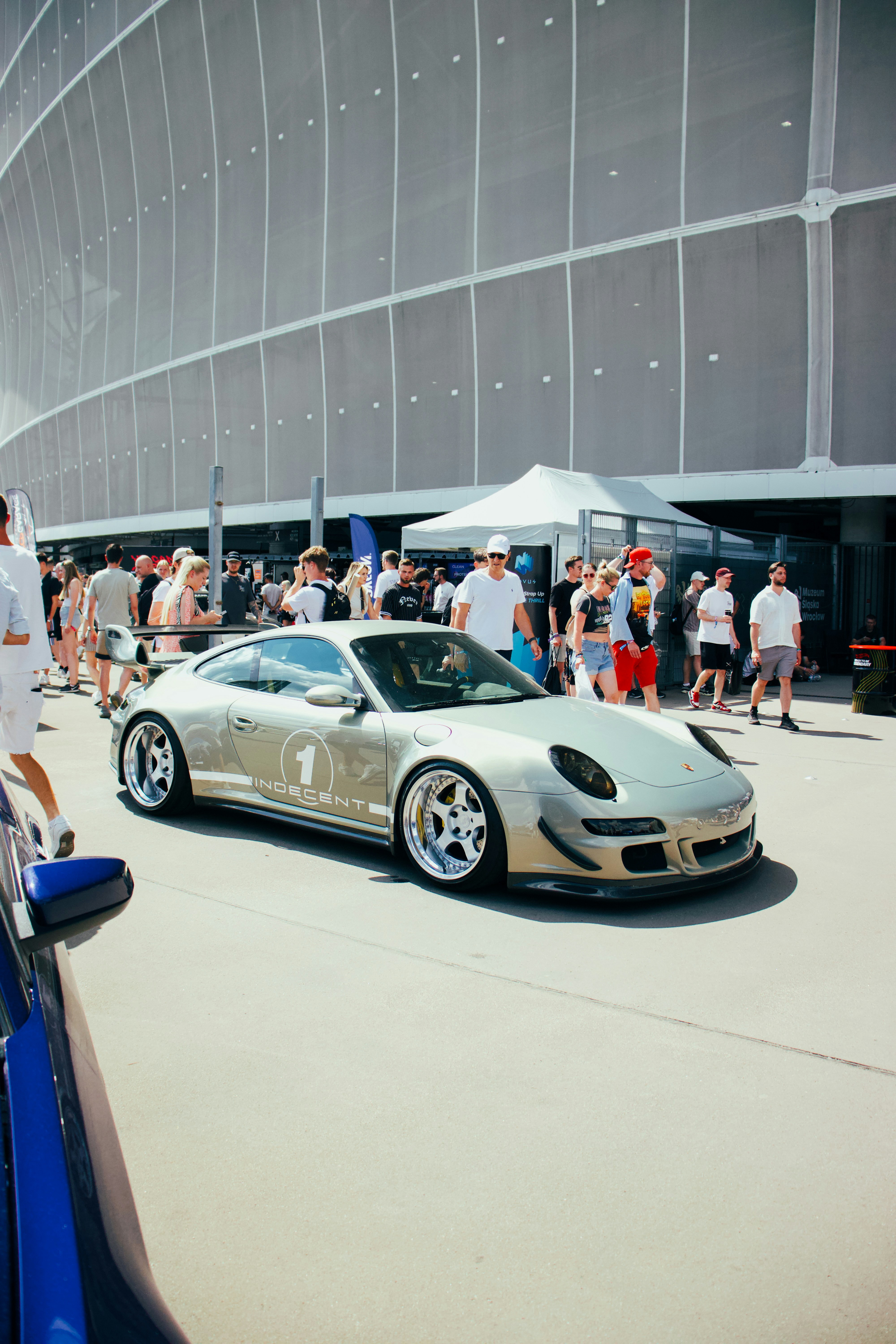 Silver Velocity: A Porsche Stands Proud at the Exhibition