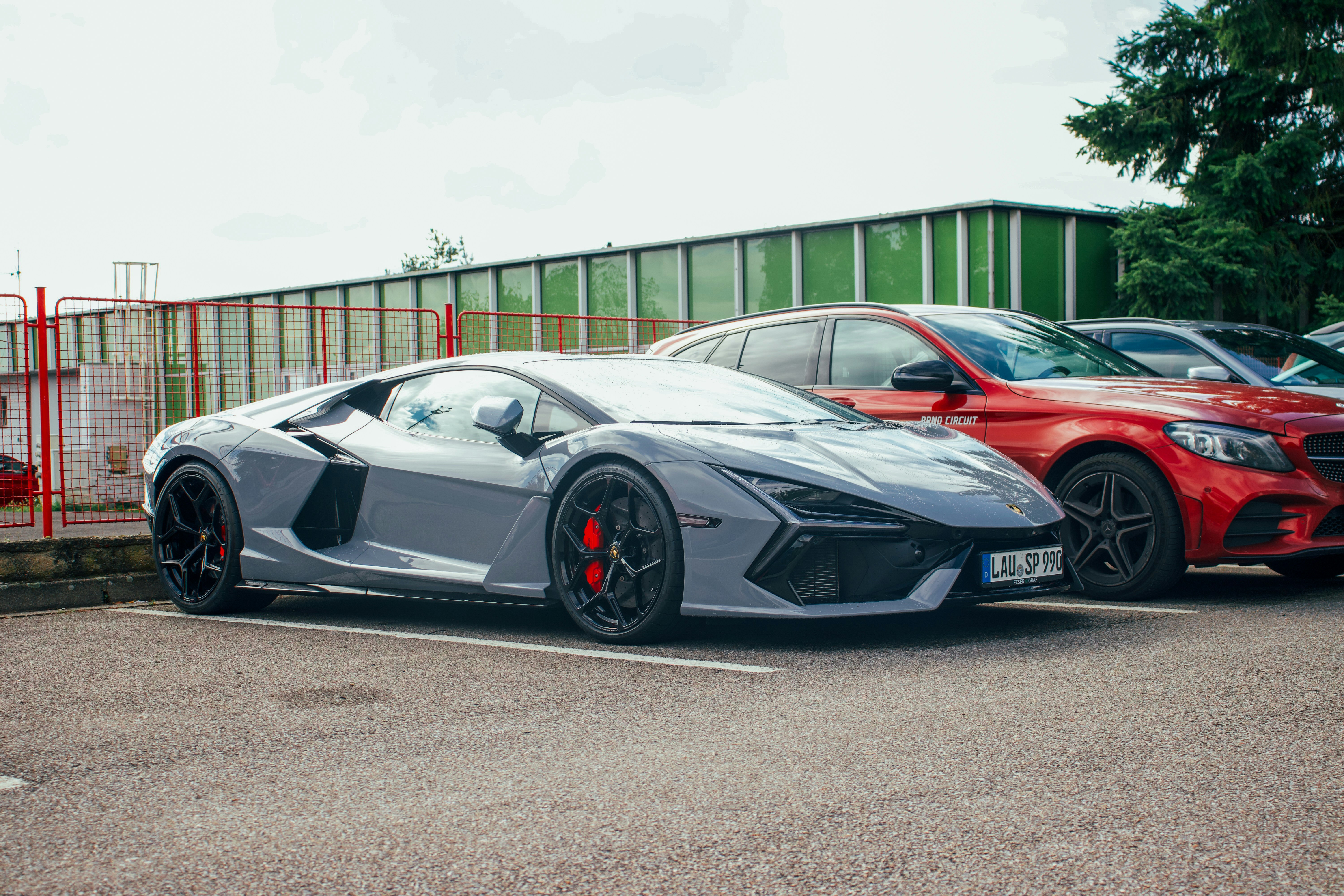 Grey Bull: A Low-Profile Lambo Guarded by Red and Steel