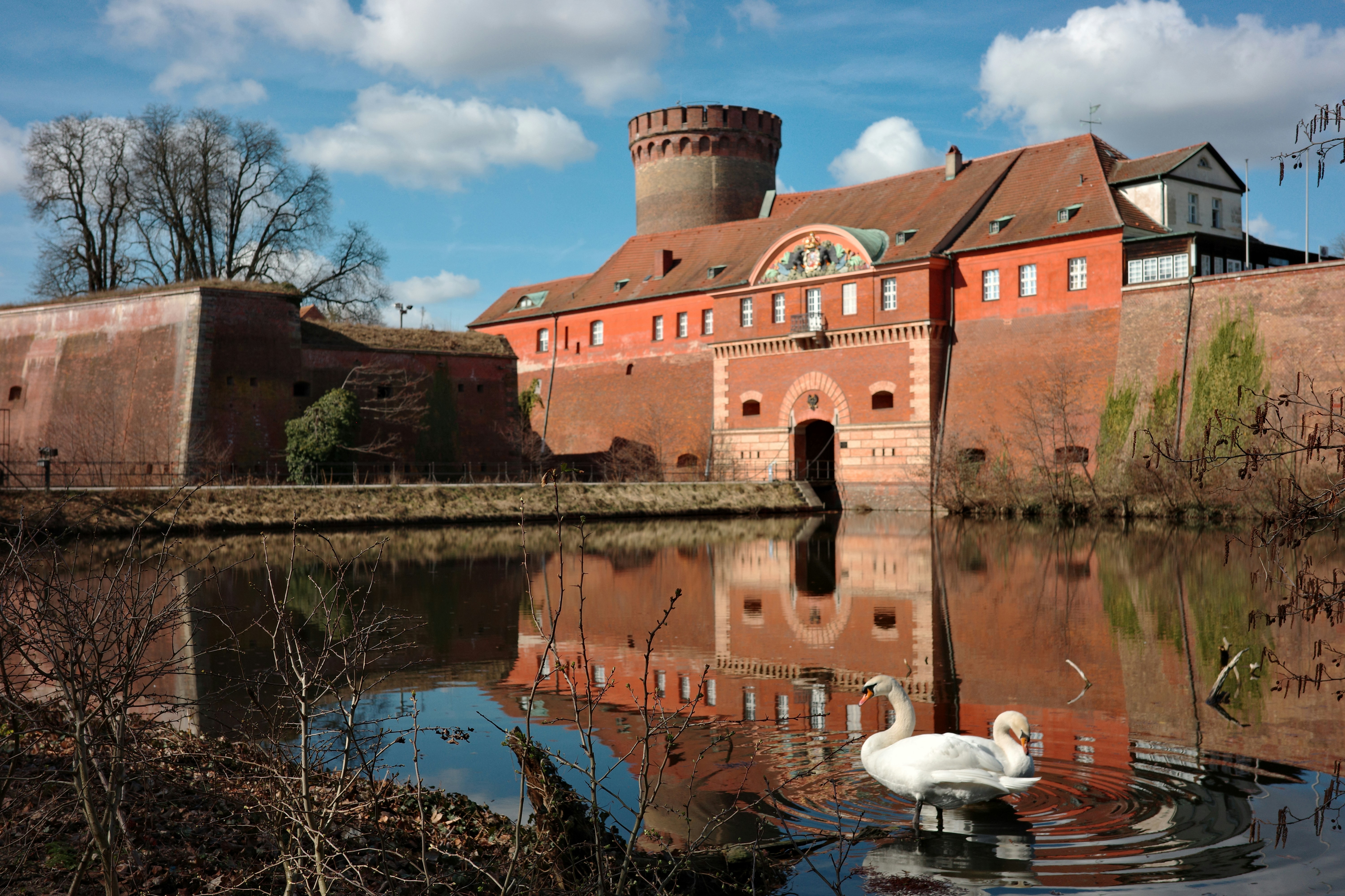 Brick Fortress by the Water: Swans at the Gate