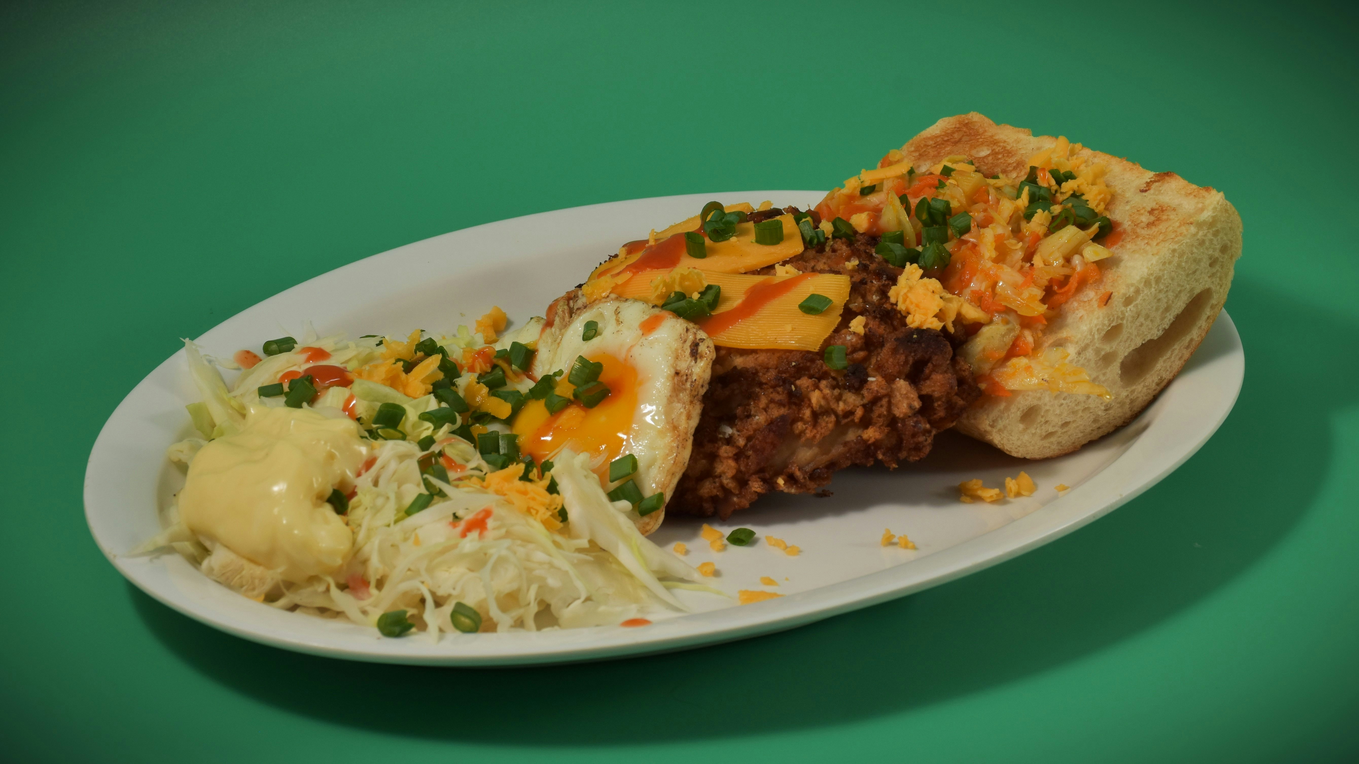 Loaded Chicken Ranch Dairy Plate on a Green Backdrop