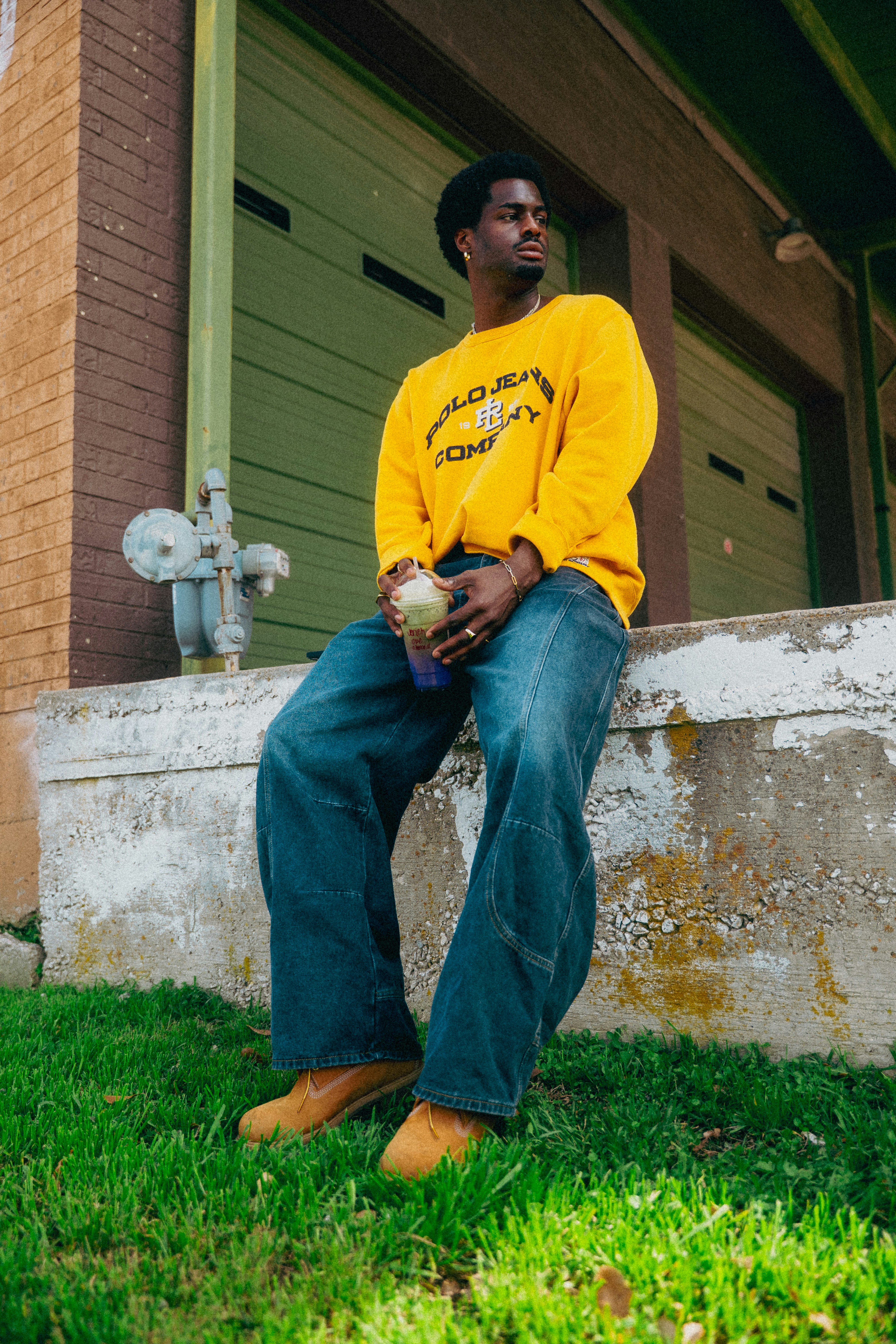 Bright Yellow Pullover, Quiet Confidence: A Portrait on the Concrete Edge