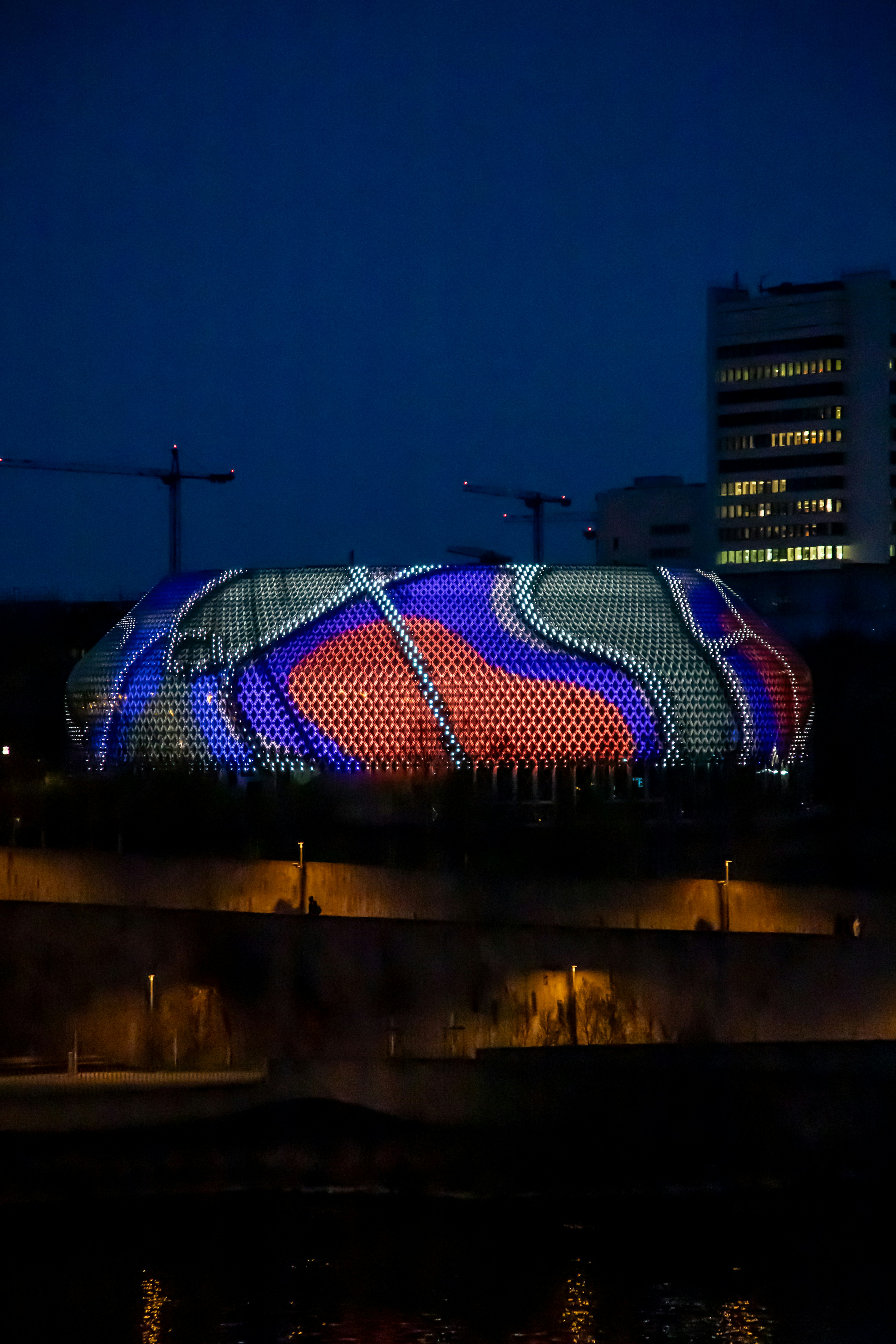 Illuminated Biomorphic Dome: Color Waves Over the River