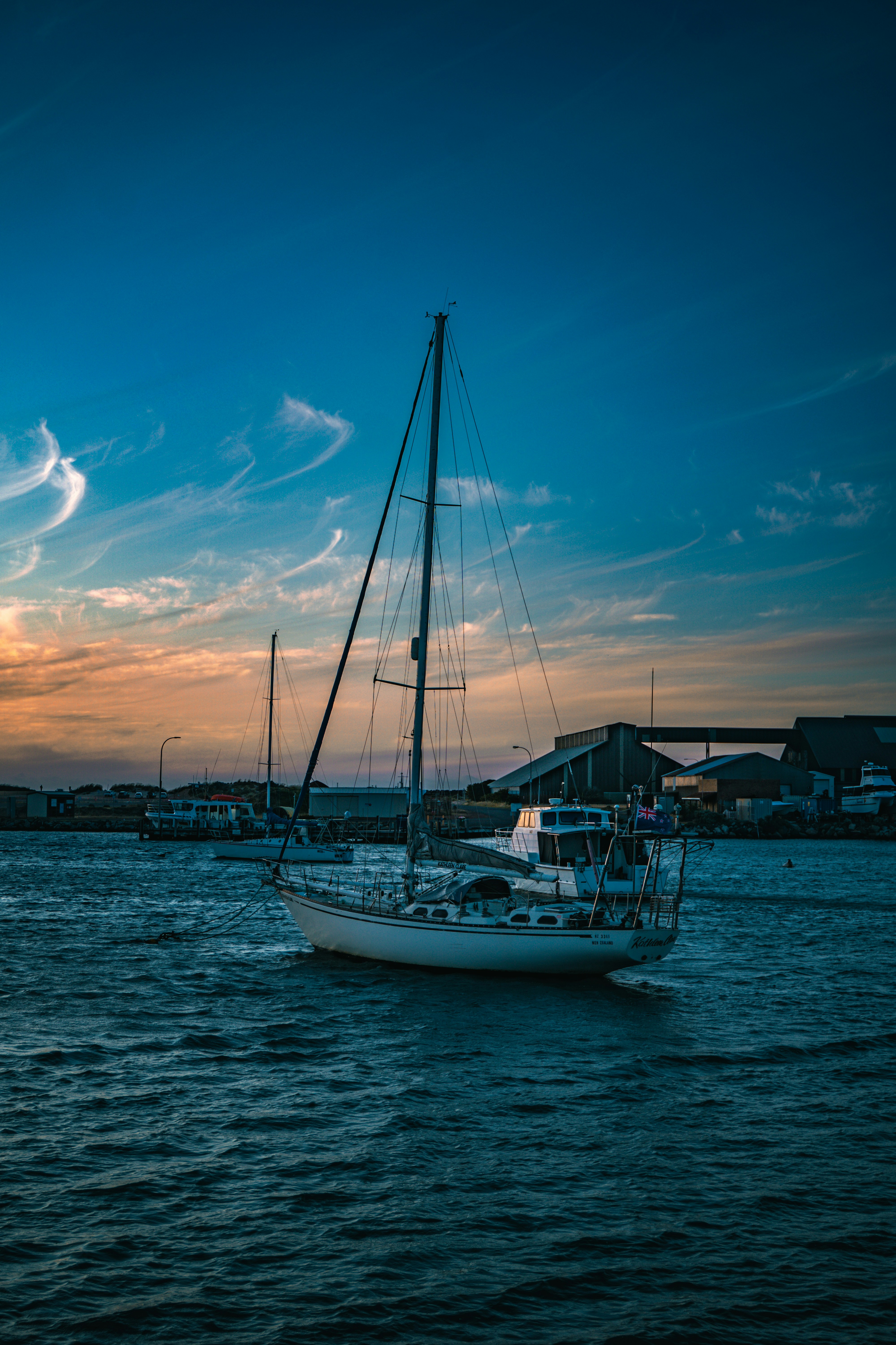 Harbor Sailboat at Dusk: Quiet Confidence on Moving Water