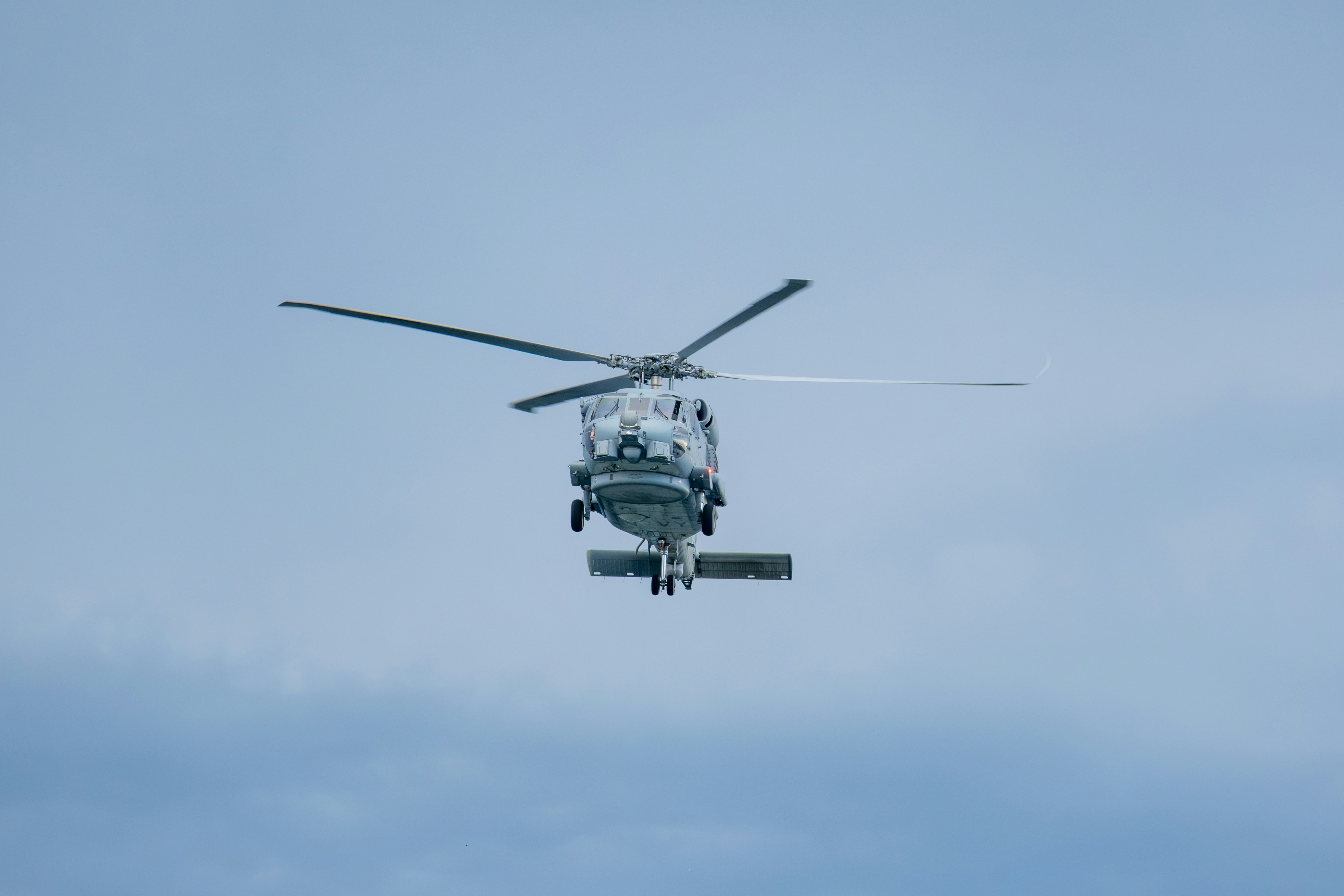 Front-and-Center Hue of Flight: A Helicopter Hover under a Serene Sky