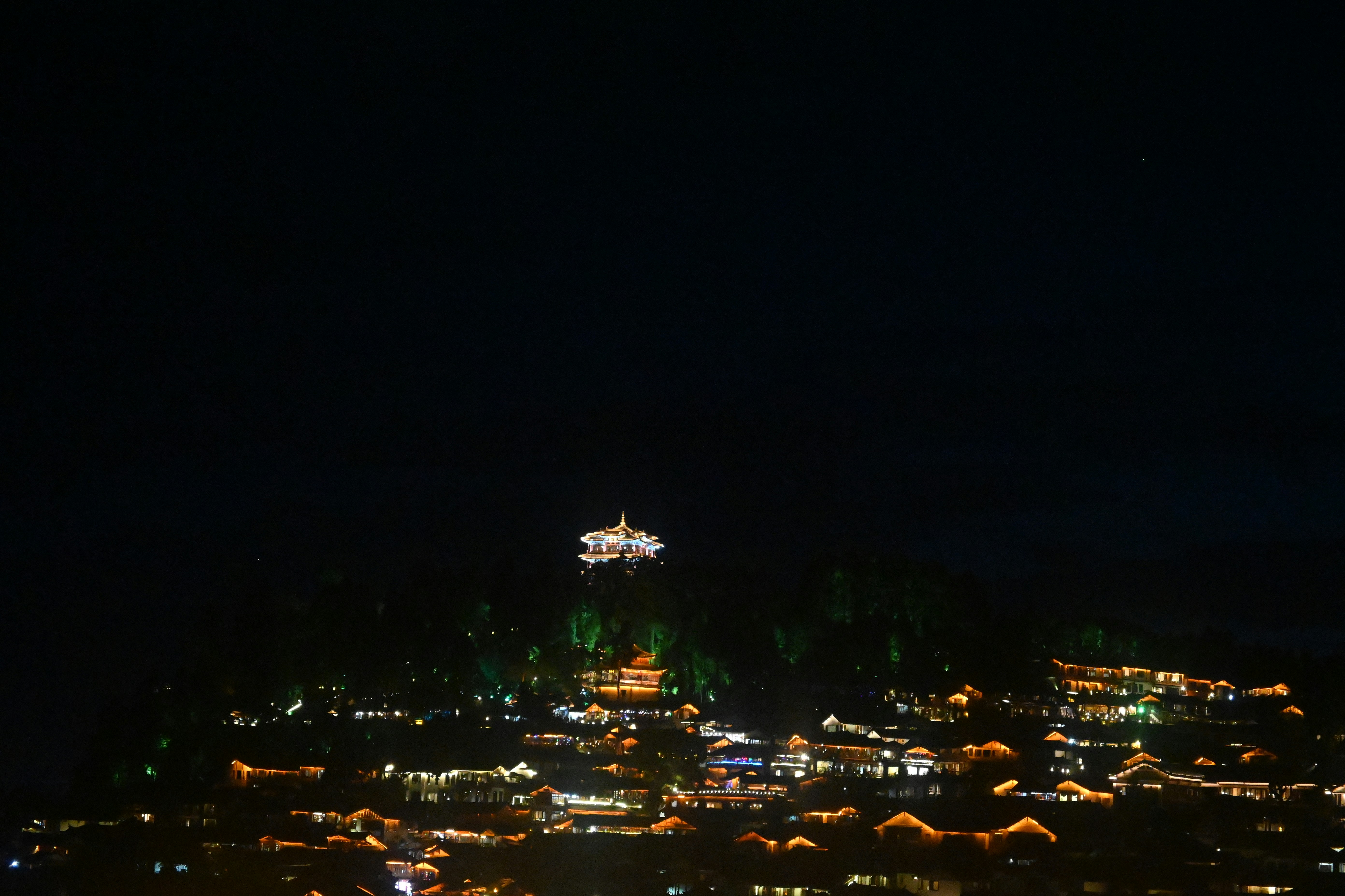 Night-Lit Terrace: A Lanterned Village Basks in Quiet Elevation