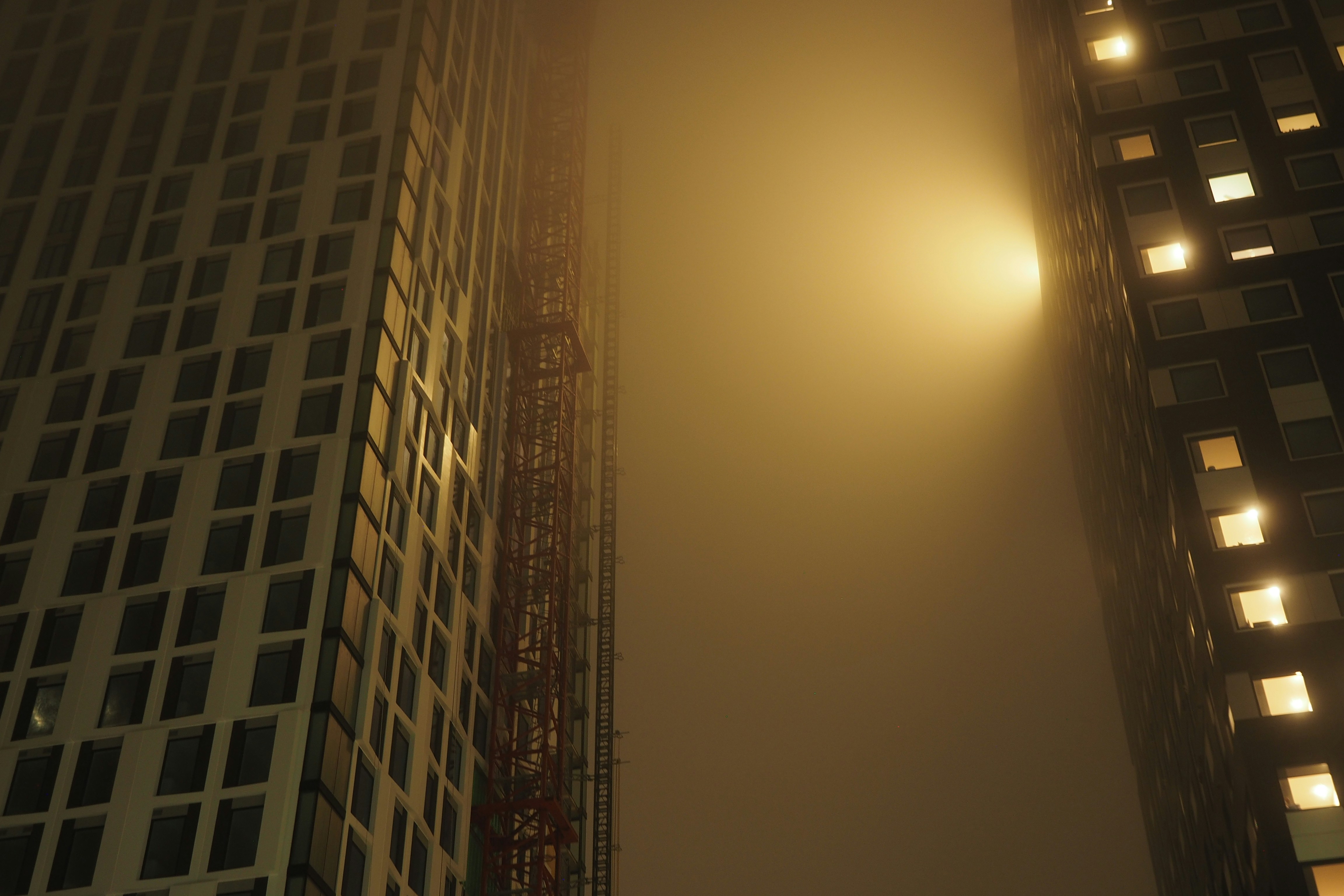 Crescent of Light Between Skyscrapers